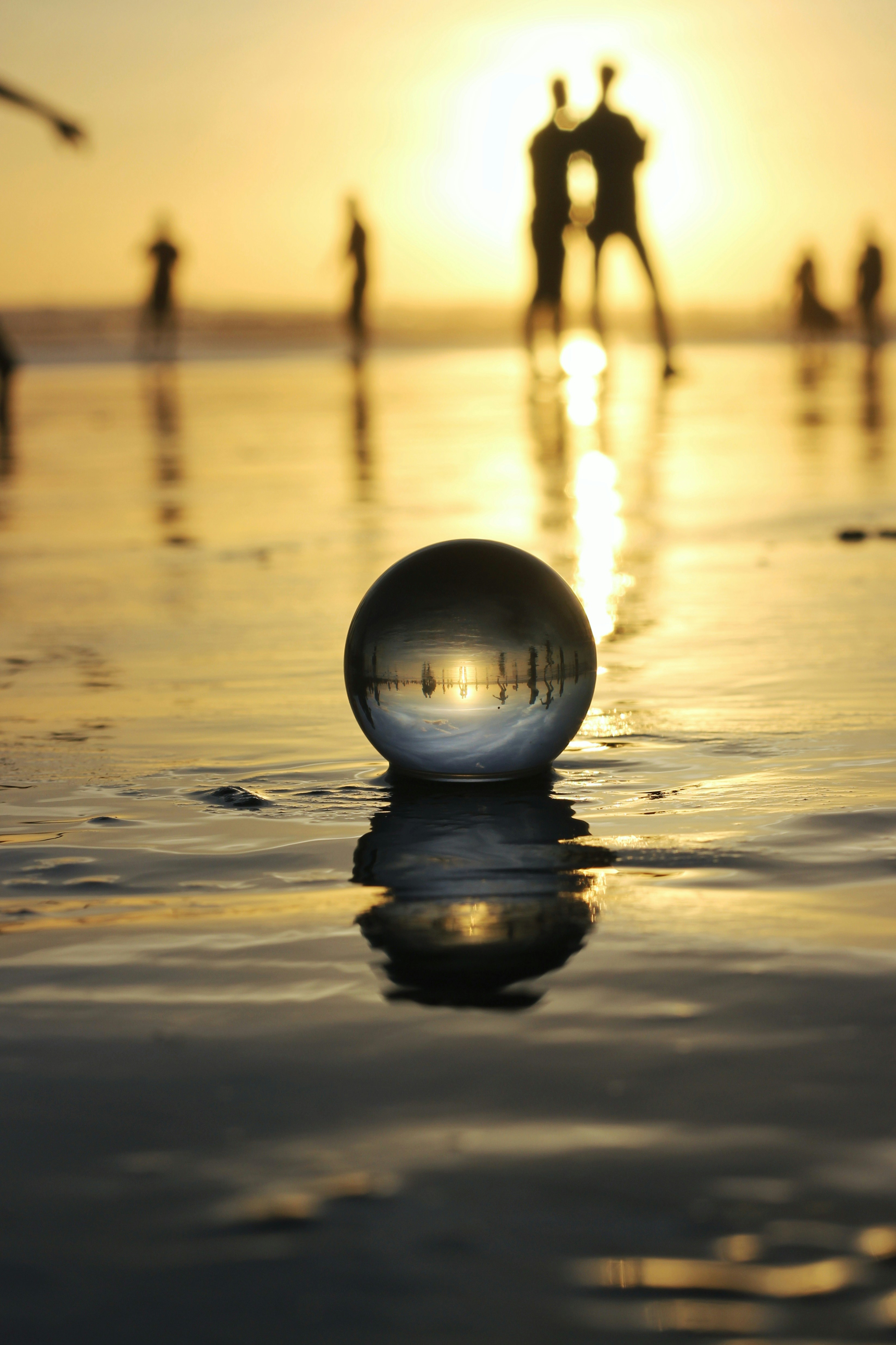 Sphere on the Shore: Reflections at Dusk