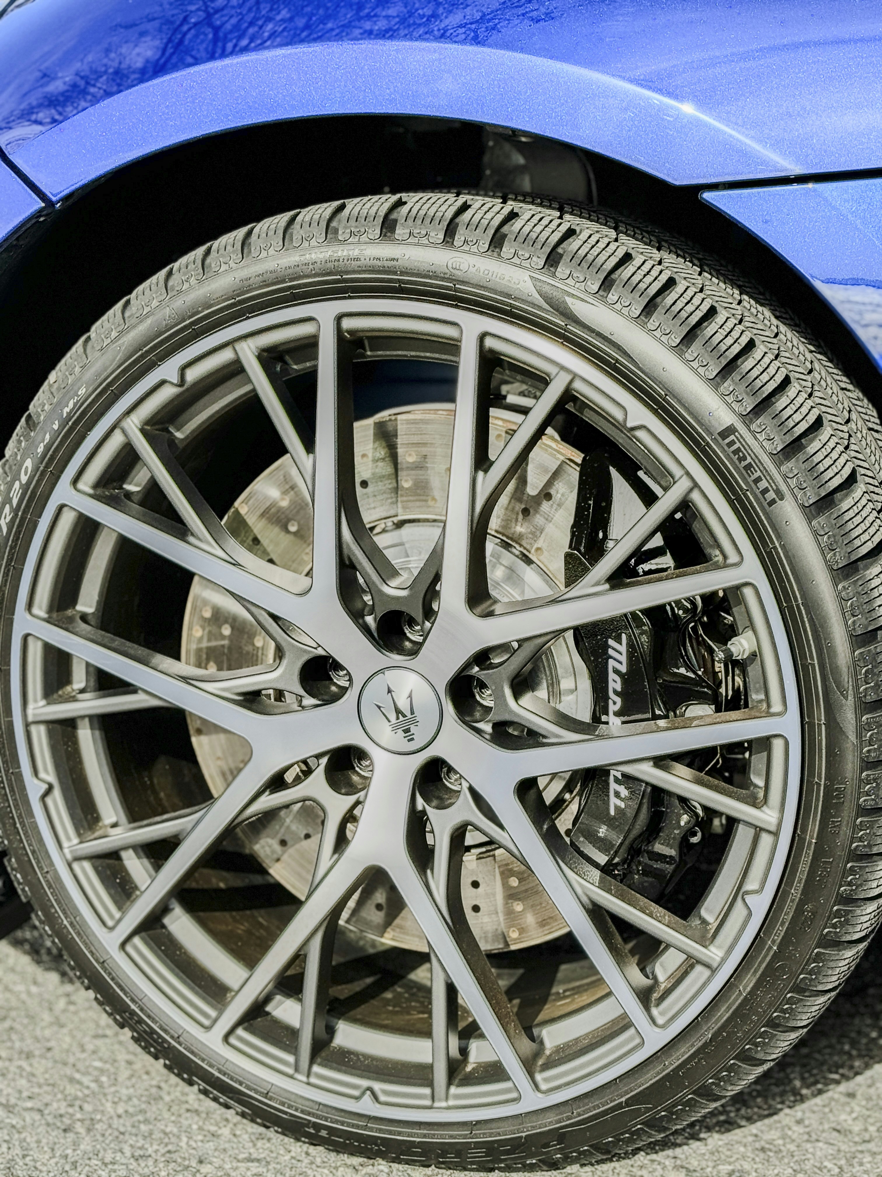A close up of a blue sports car tire photo – Free Wheel Image on Unsplash