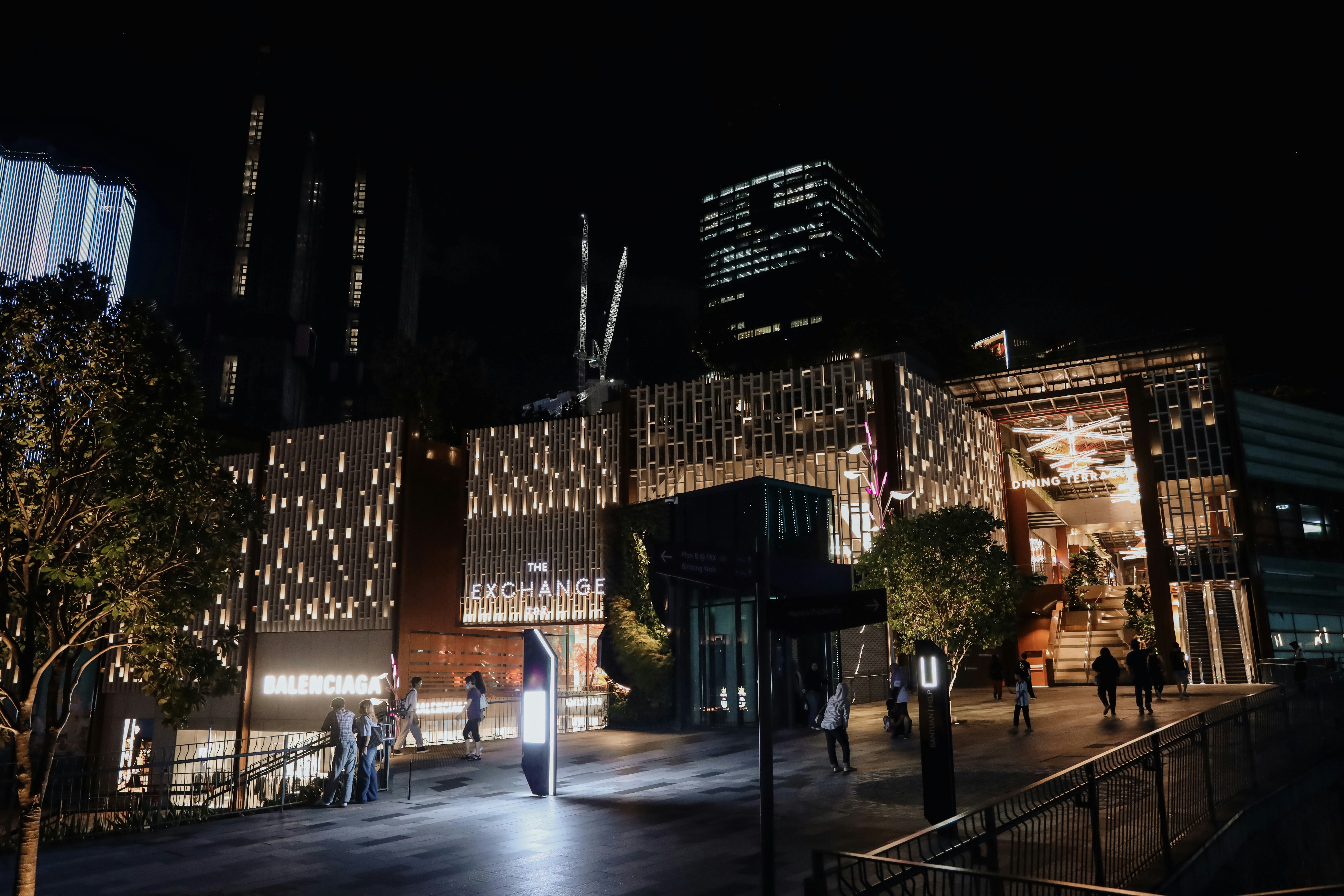 A night time view of a building with a lot of lights photo – Free The ...