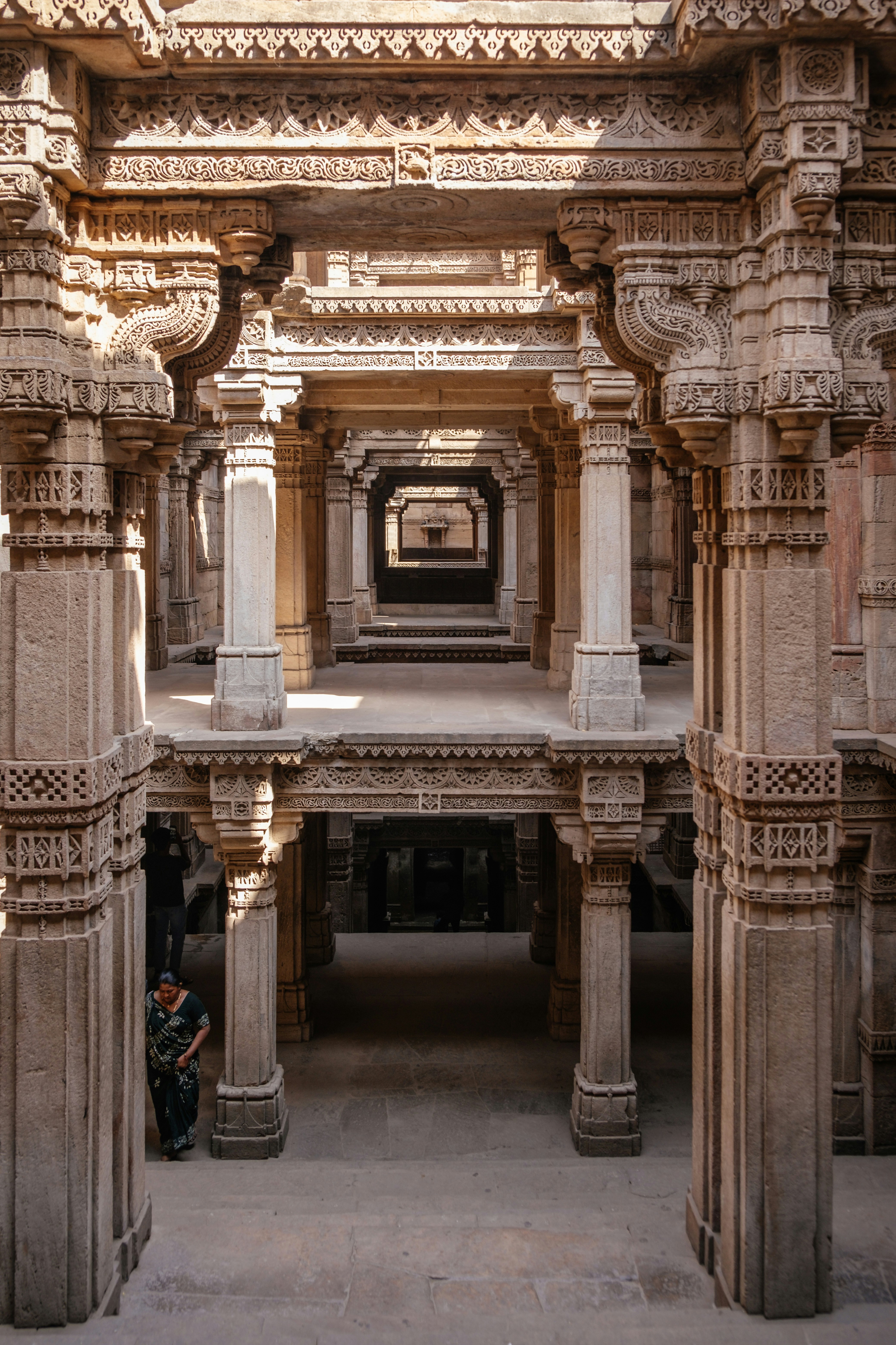A large building with pillars and pillars in it photo – Free Gujarat ...