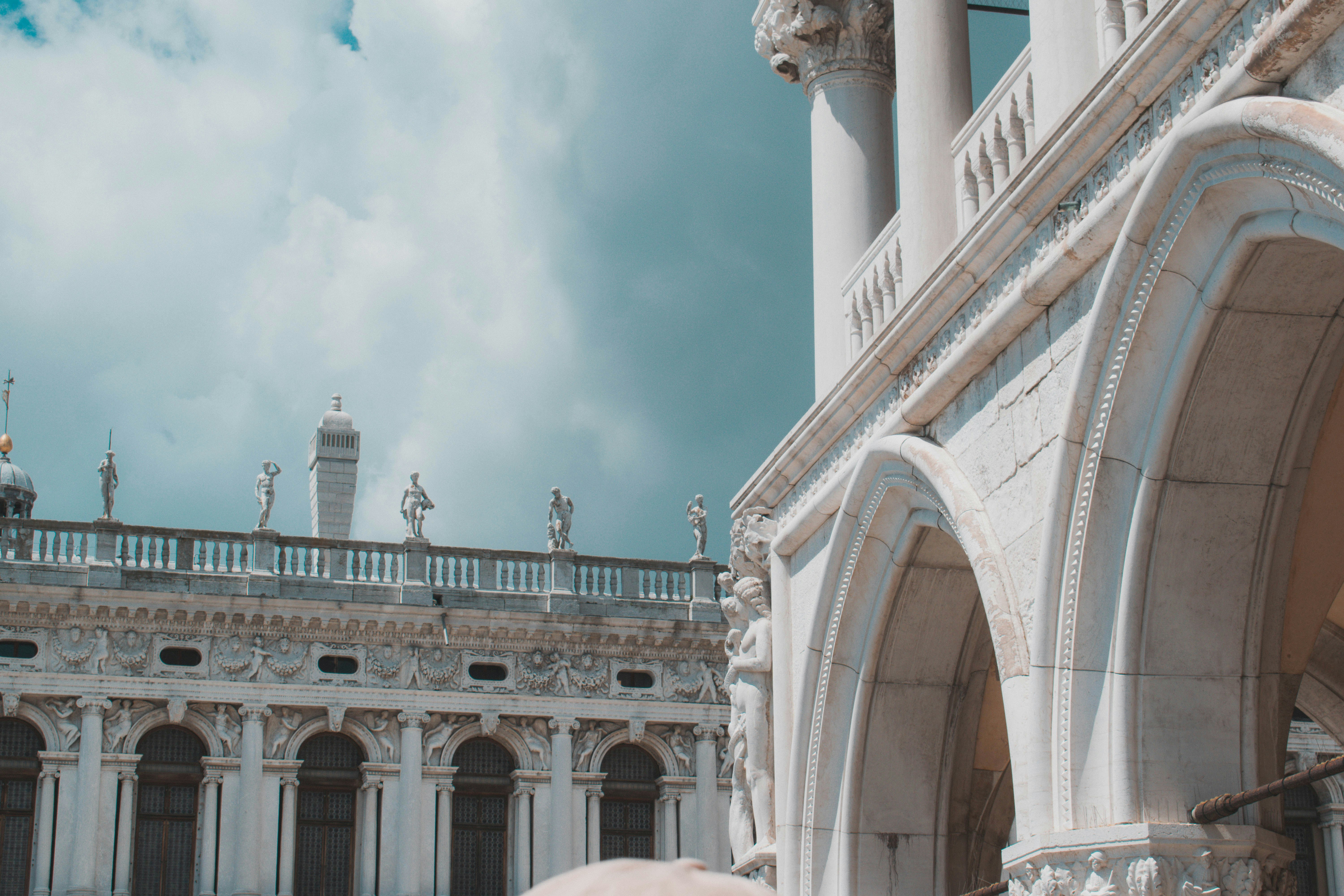 Arched Grandeur: Classical Facade Framed by Sky