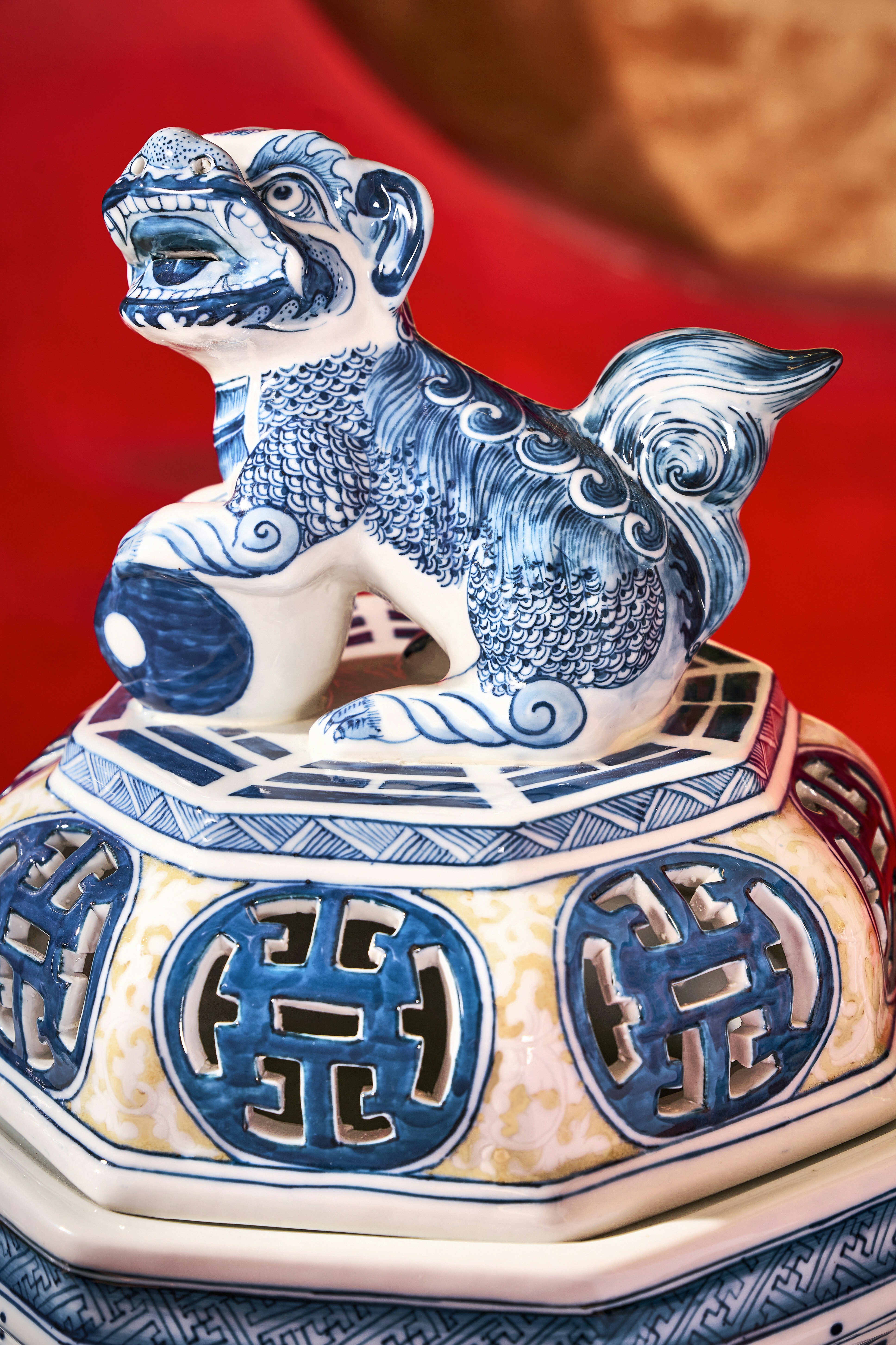 Cerulean Foo Dog Serenely Perched on a Lattice-Patterned Pedestal