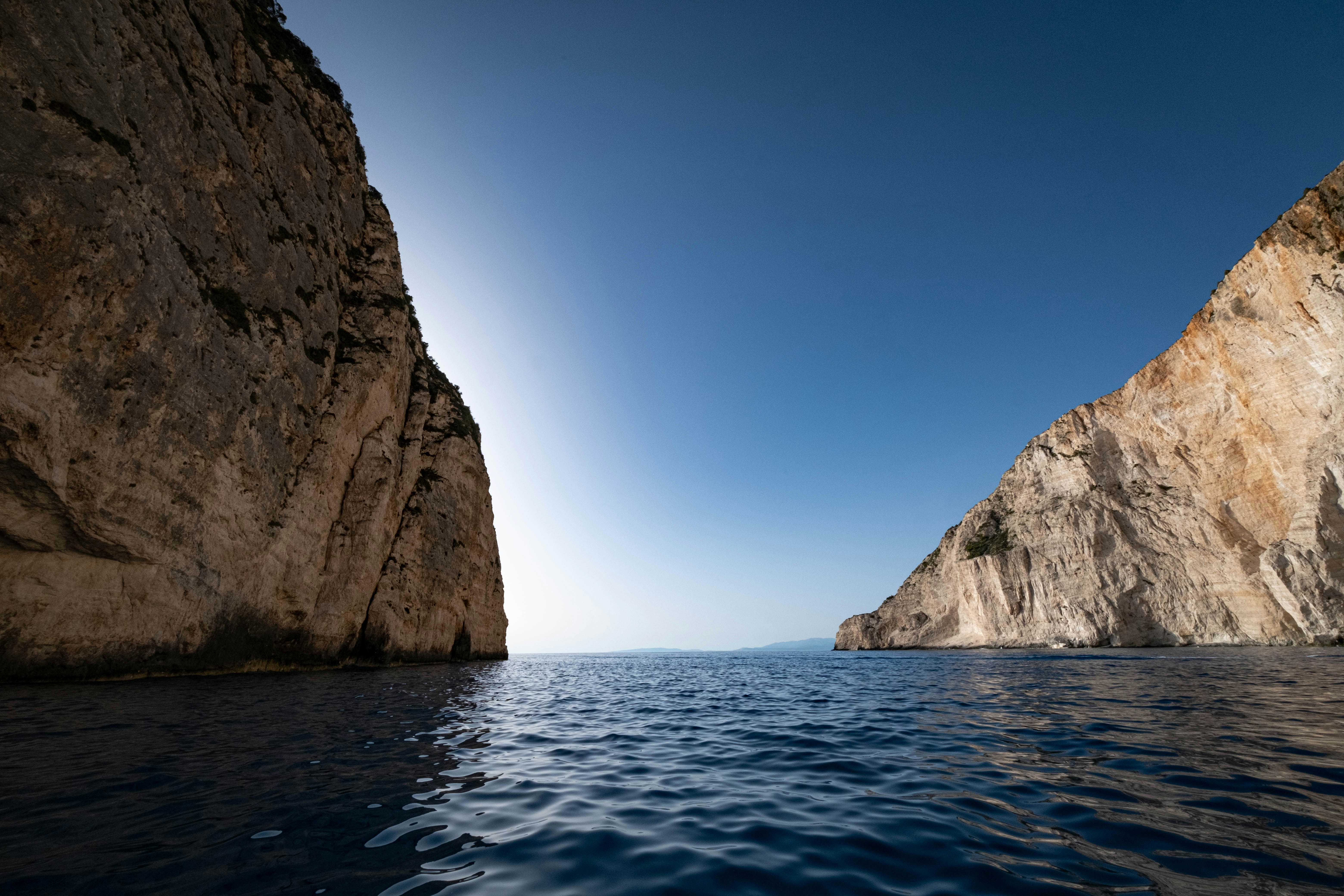 A view of a rock outcropping in the ocean photo – Free Nature Image on ...