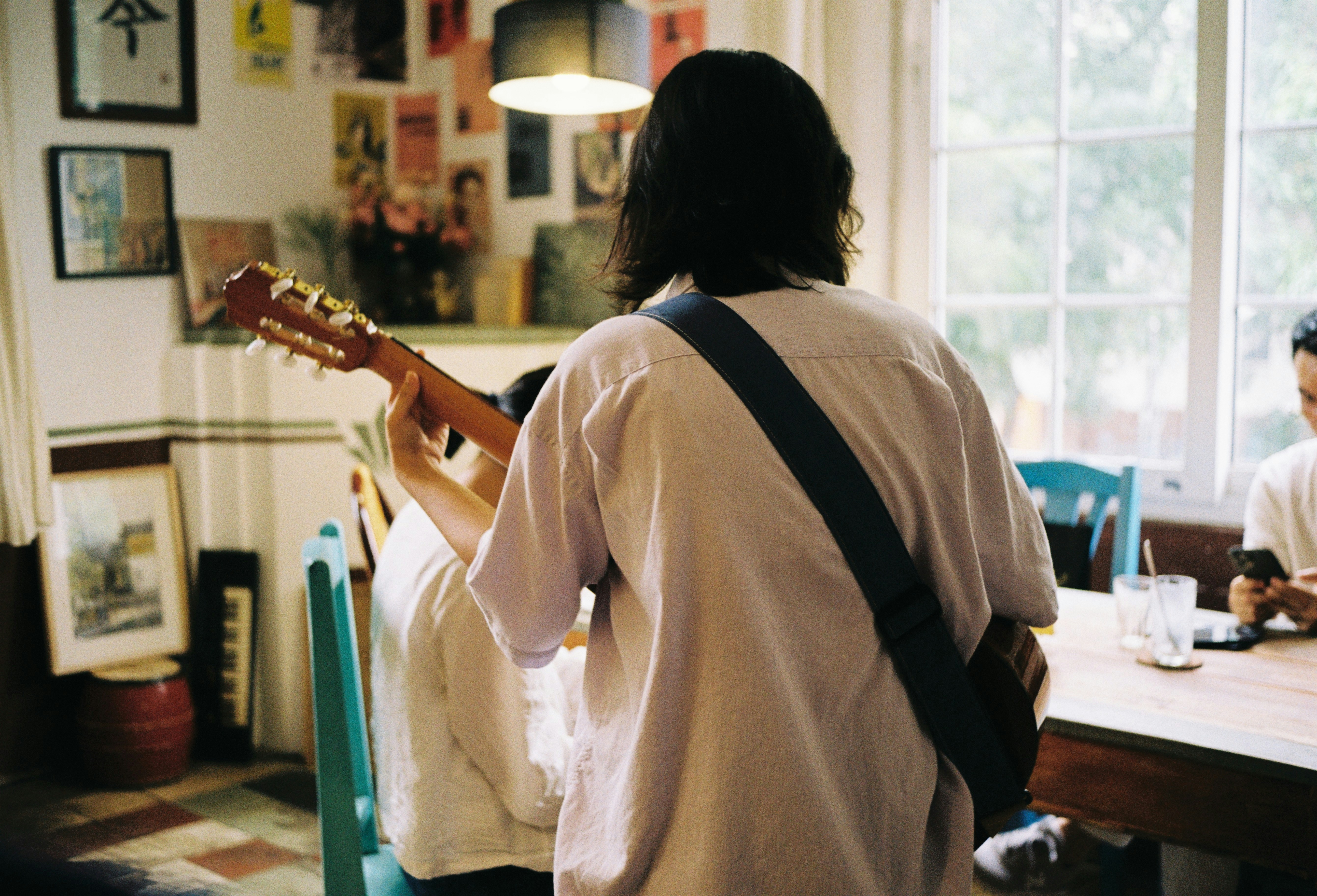Guitar at the Backroom Bar: A Quiet Moment in a Café Jam