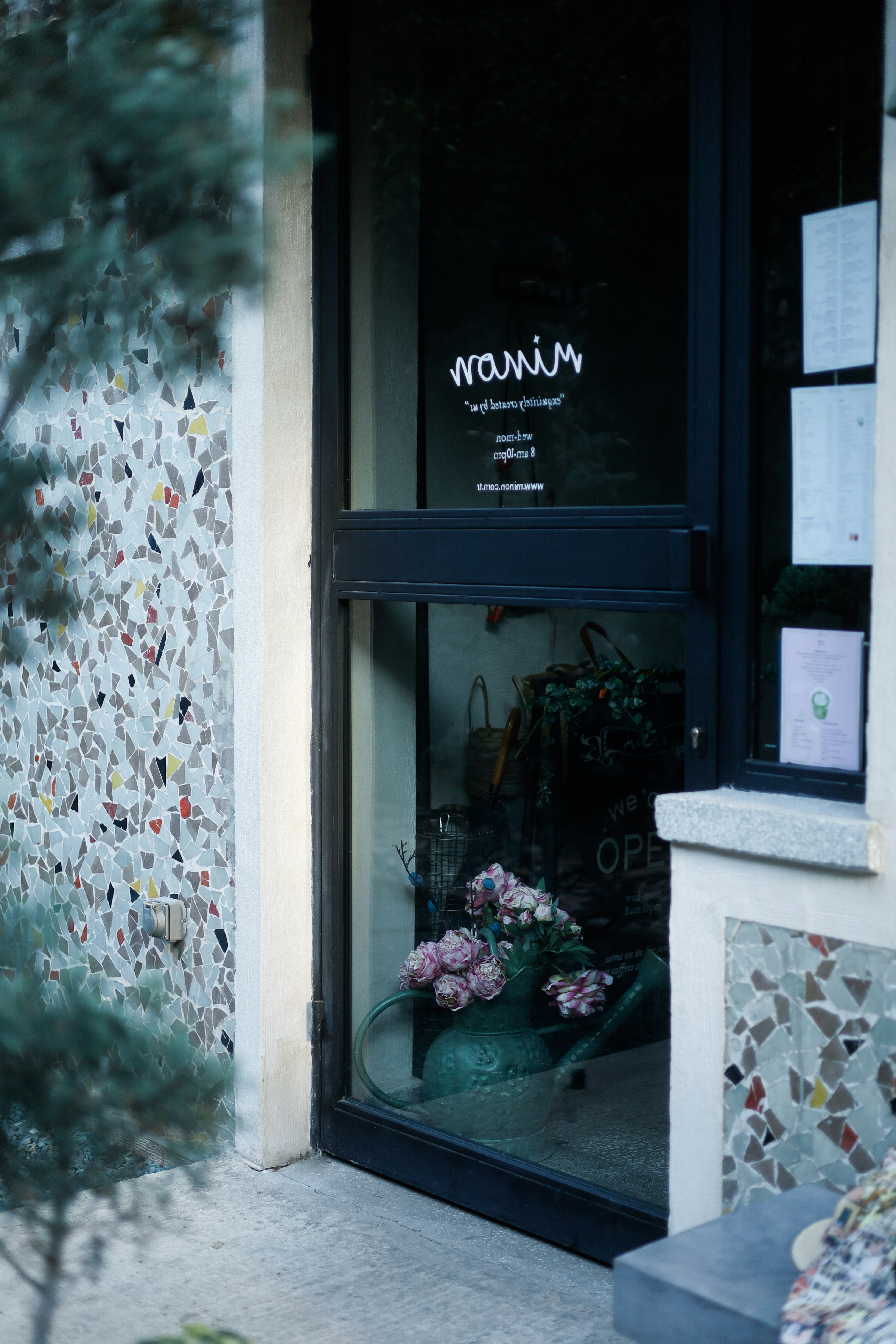 A store front with a flower display in the window photo – Free Potted ...