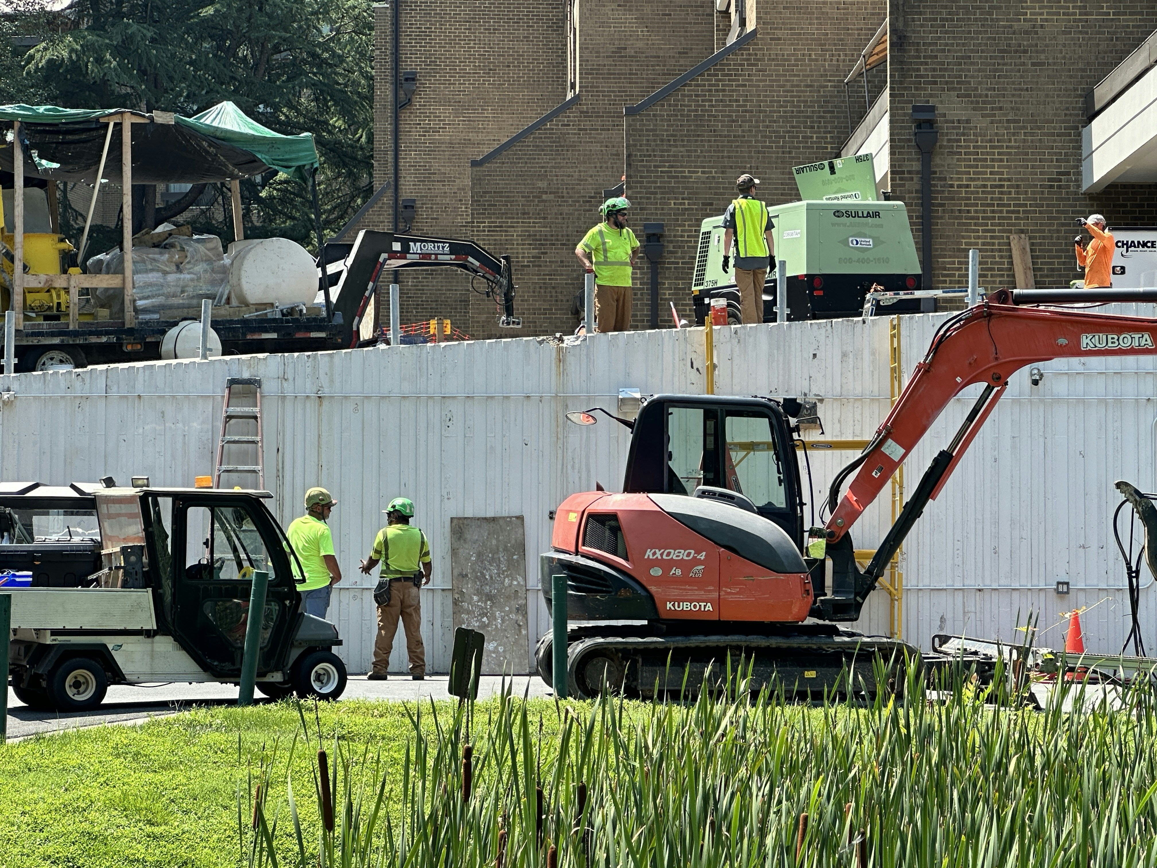 Crane and Excavator Siege: Construction Rhythm at Ground Level