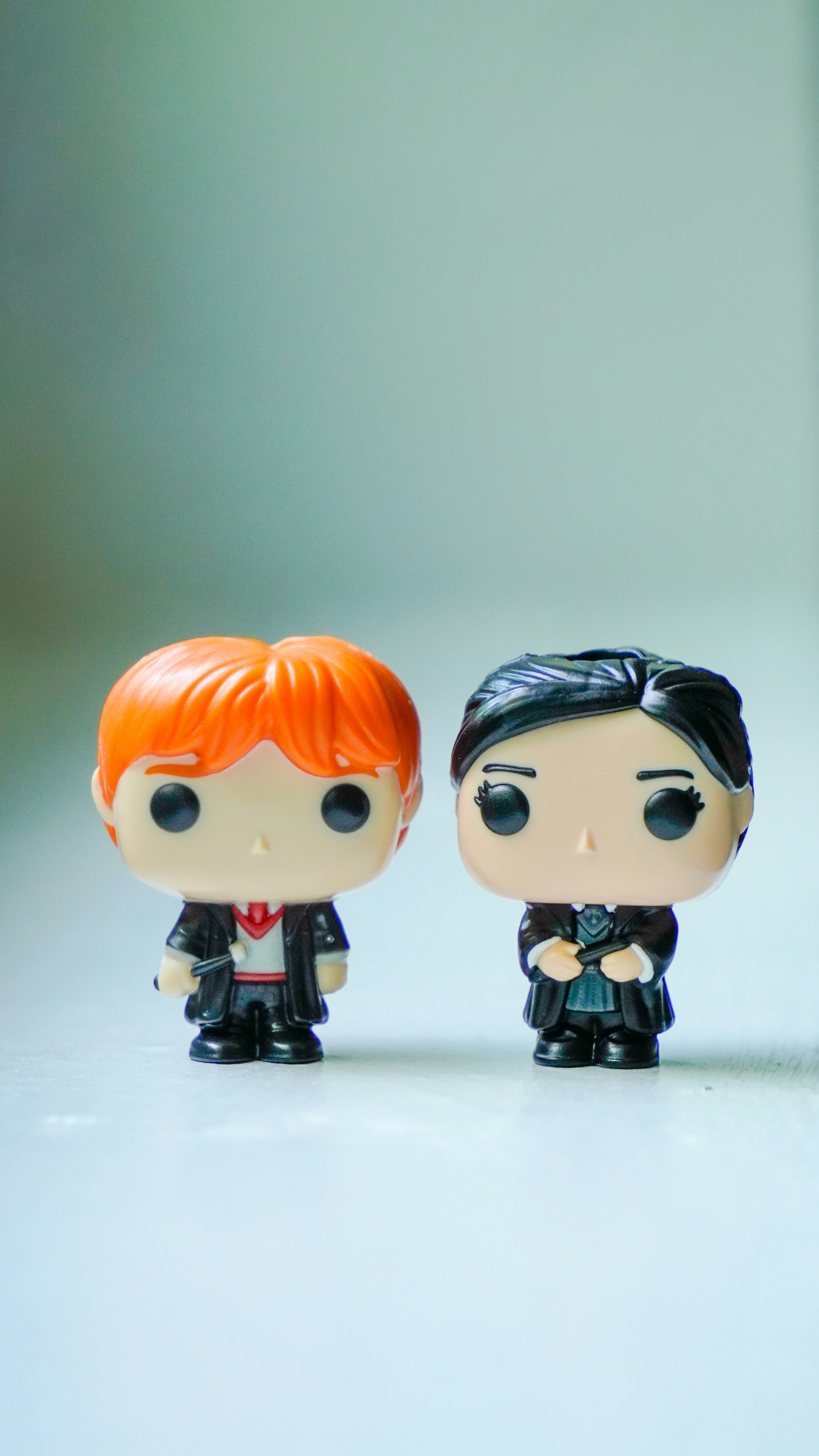 Minty Stillness: Two Funko Pop Figures Stand Side by Side