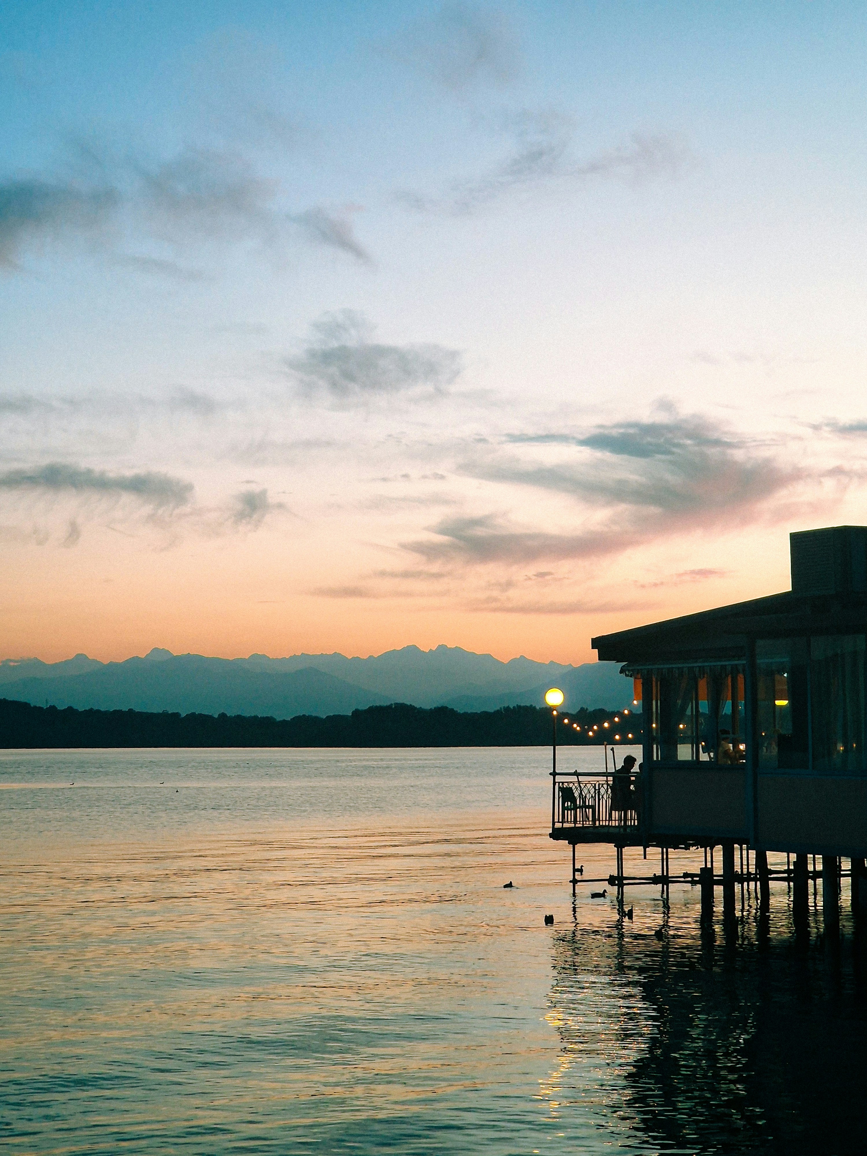Dusk Lantern on the Water: A Quiet Pier's Glow