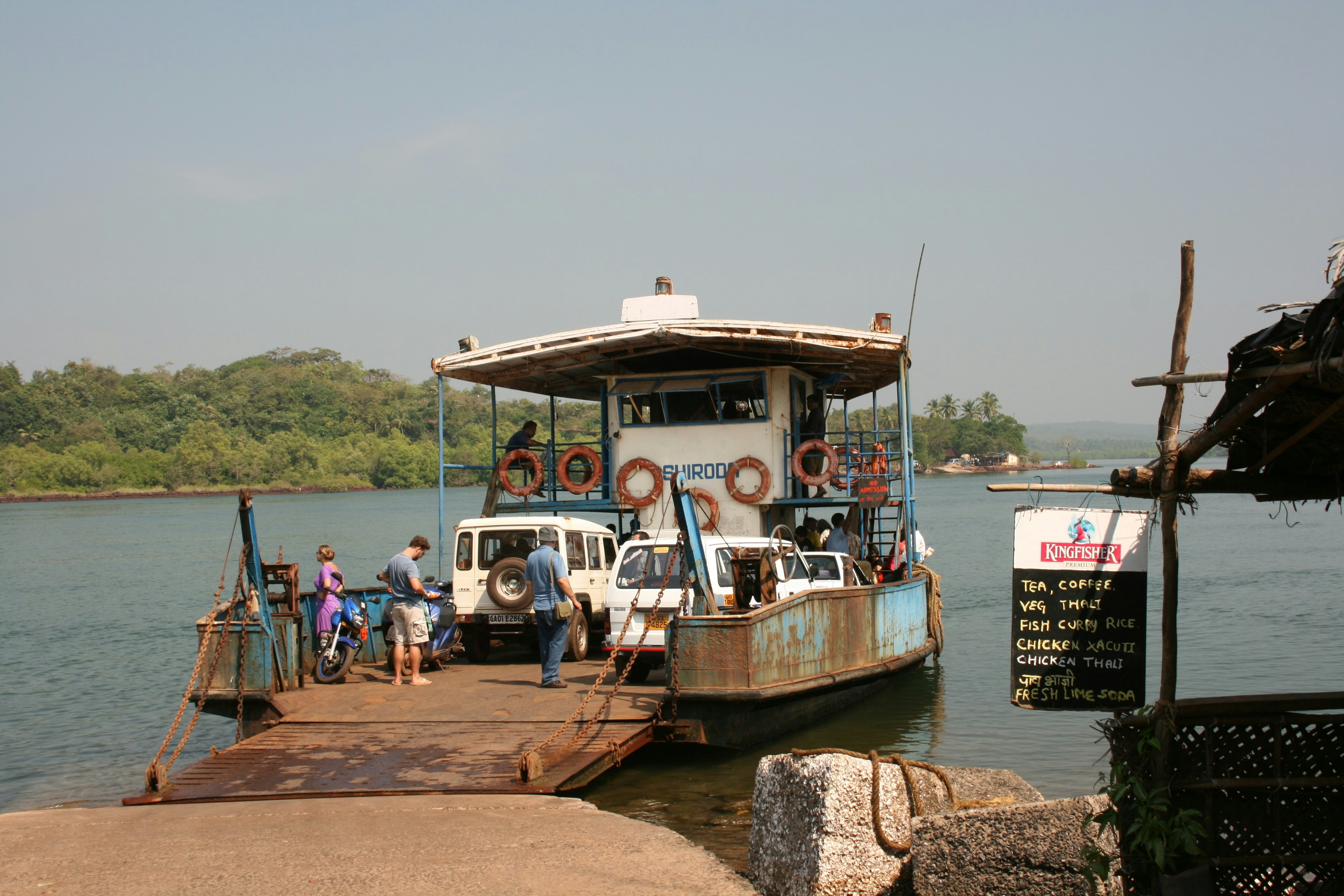 Sunlit River Ferry at the Dock: A Busy Quay Moment