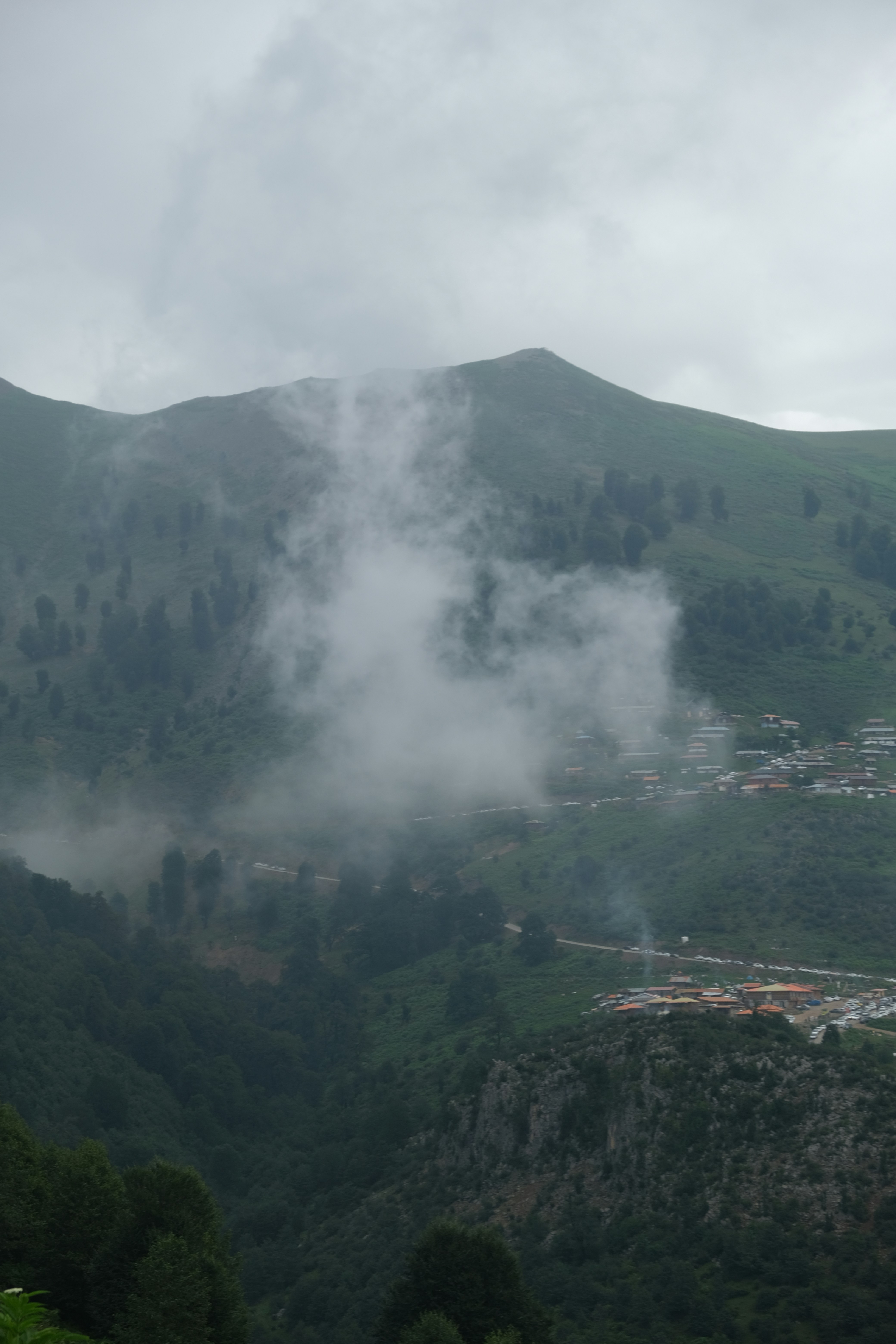 Smoke Threads Through the Green Highlands