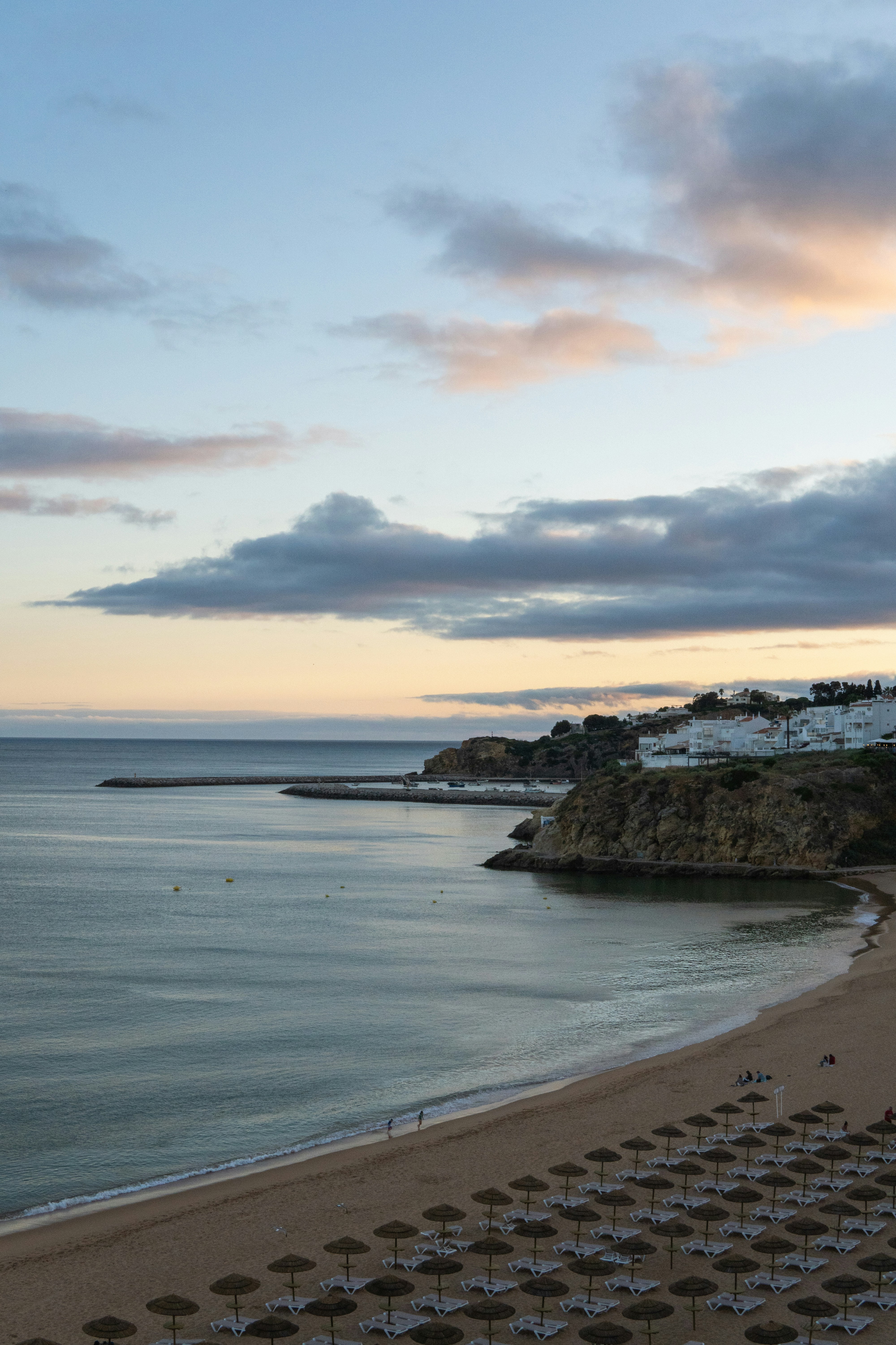Clifftop Whitewashed Village at Dusk Over a Quiet Costa Beach