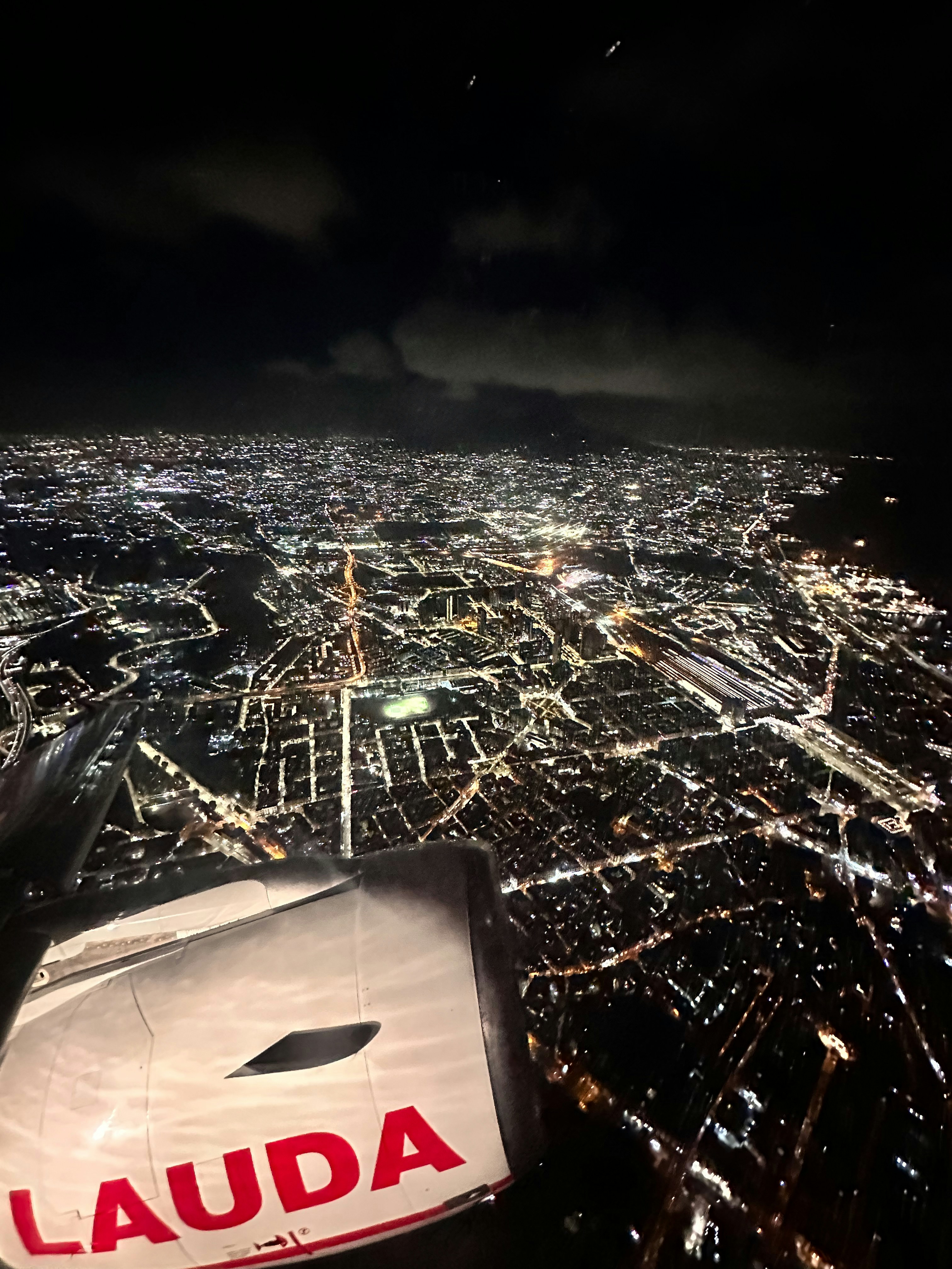 Aerial Mosaic: Neon Grid Over a Nighttime Metropolis