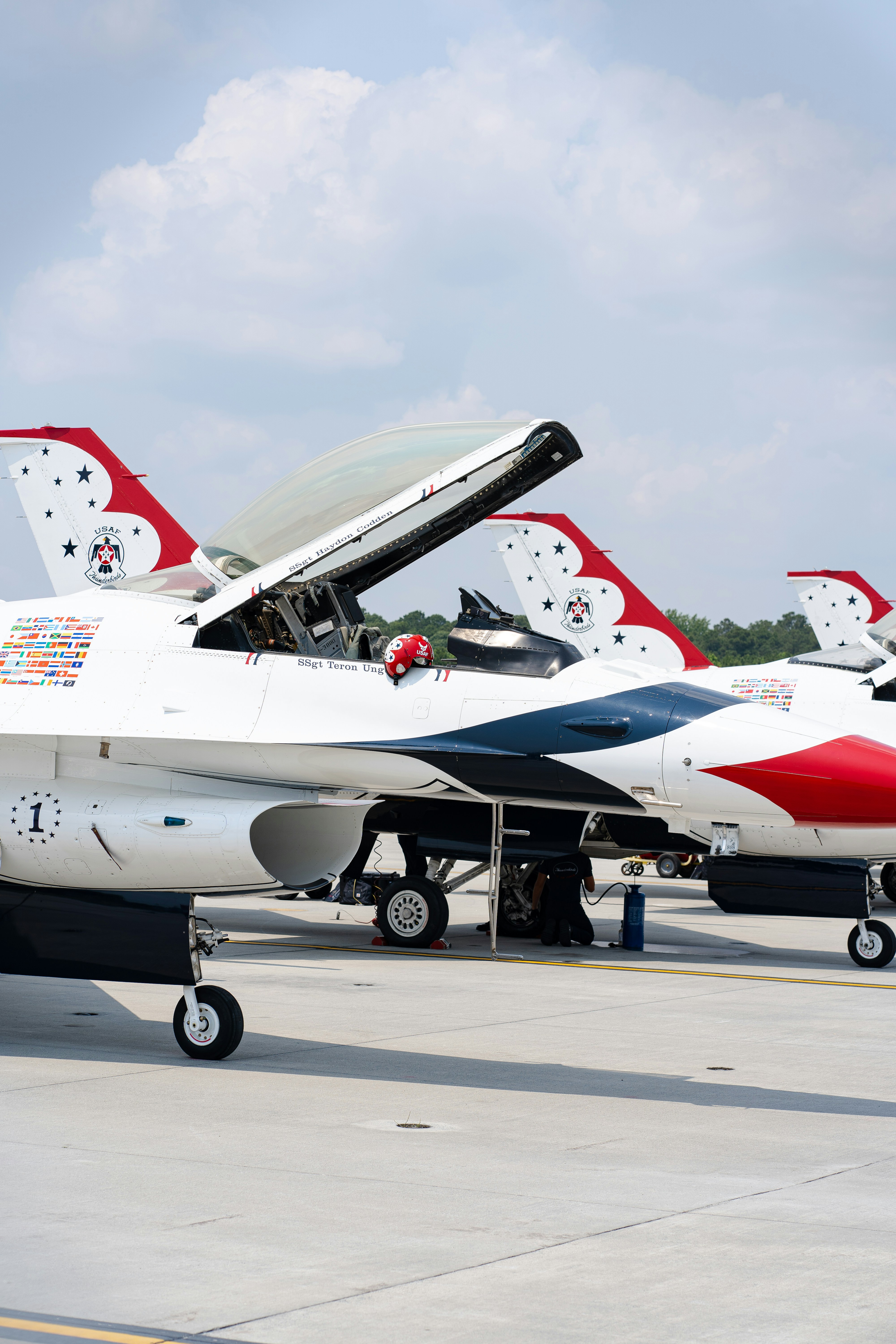 A row of fighter jets sitting on top of an airport tarmac photo – Free ...