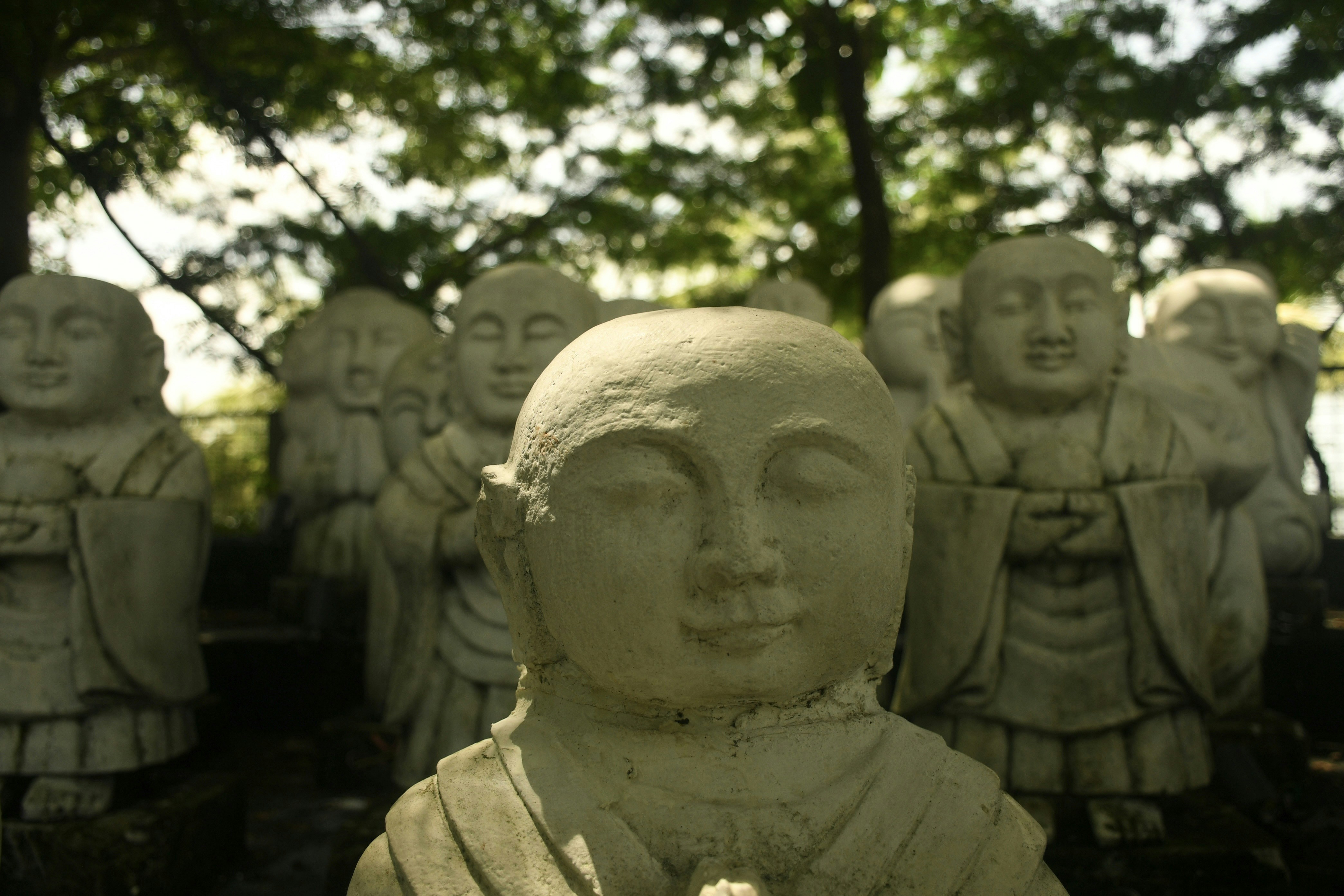 A group of statues sitting next to each other photo – Free Art Image on ...