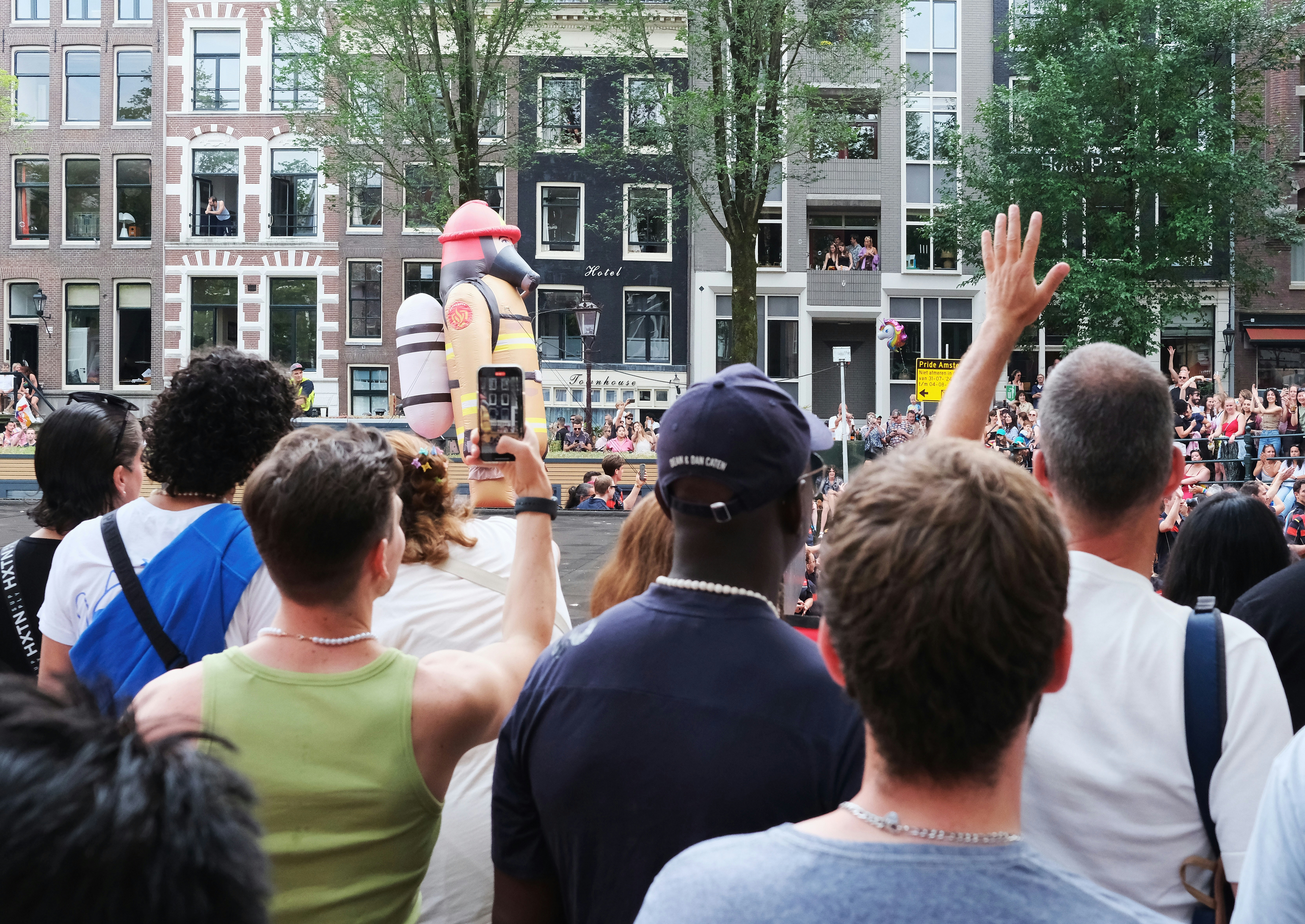 A crowd of people watching a float in a parade photo – Free City Image ...