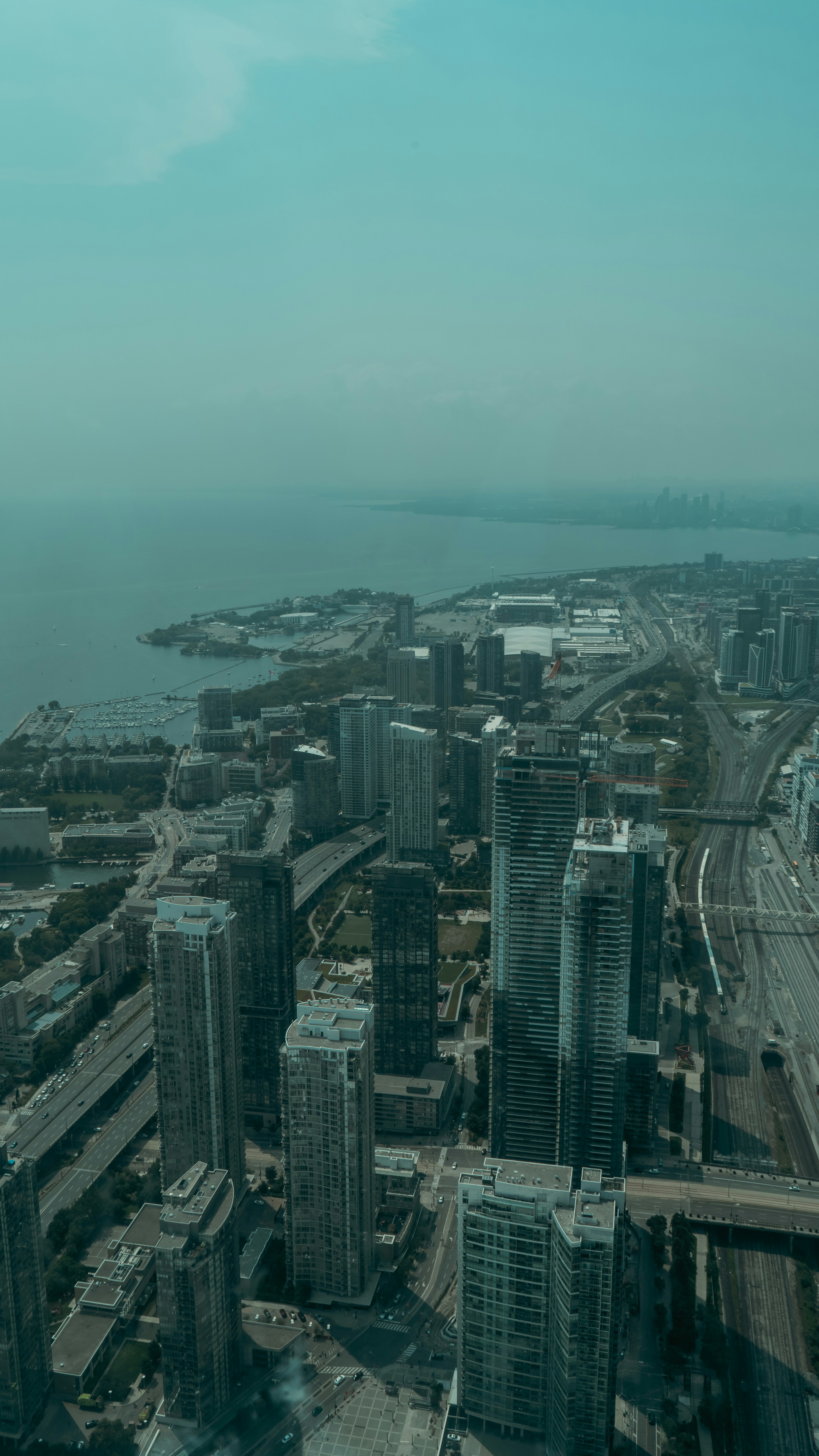 An aerial view of a city and the ocean photo – Free Toronto Image on ...