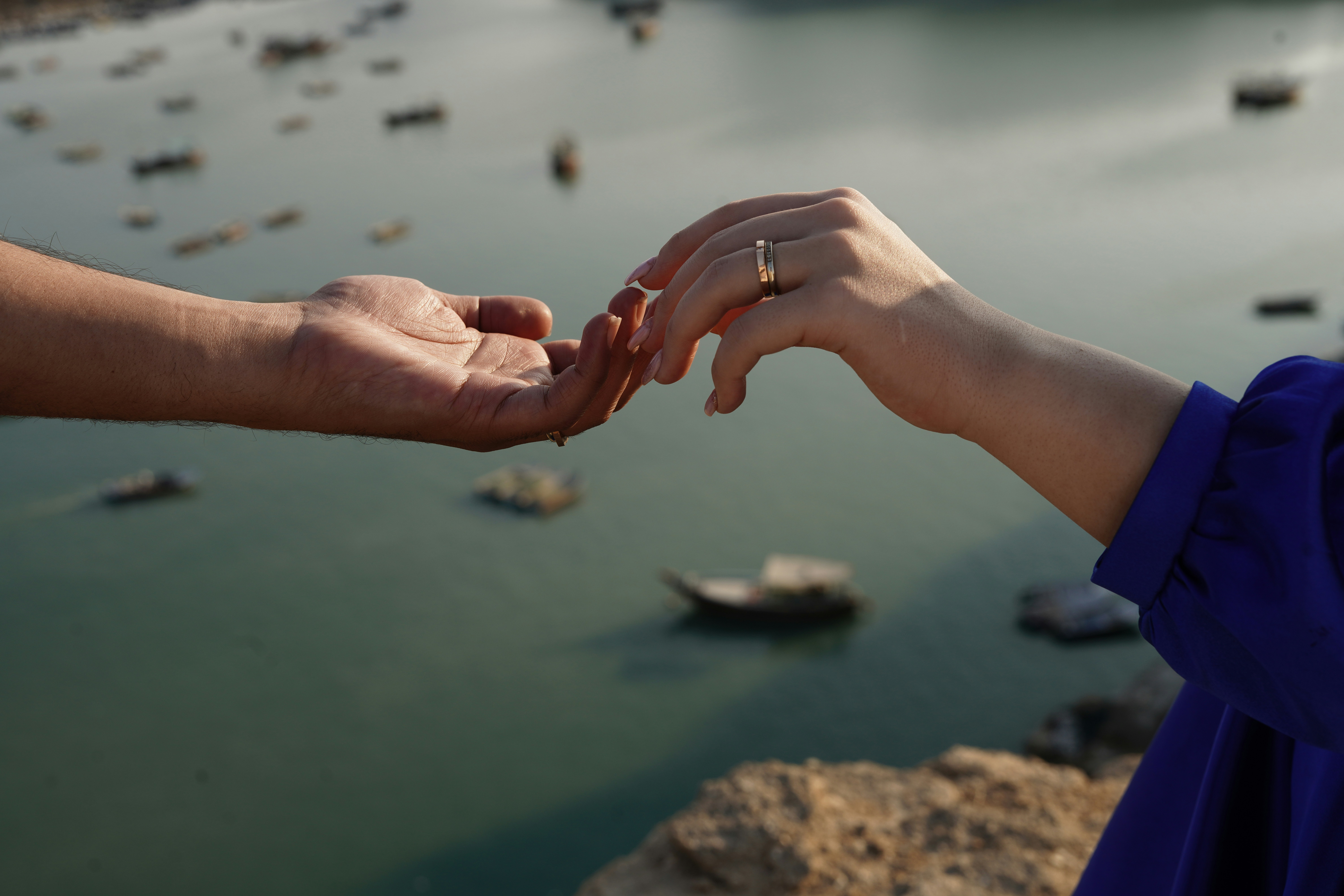 Two people reaching out their hands to each other photo – Free Symbol ...