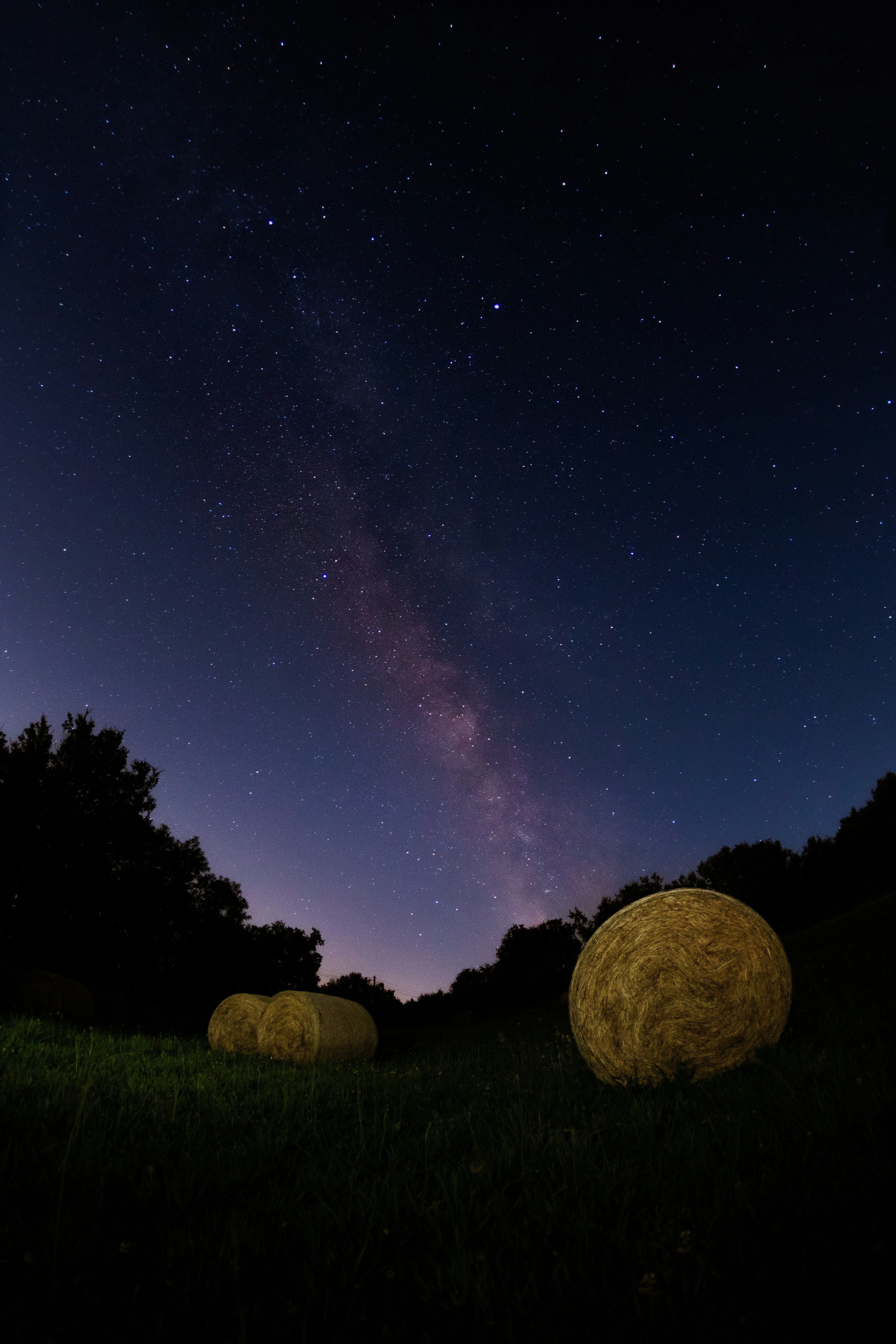 Three bales of hay in a field under a night sky photo – Free Nature ...