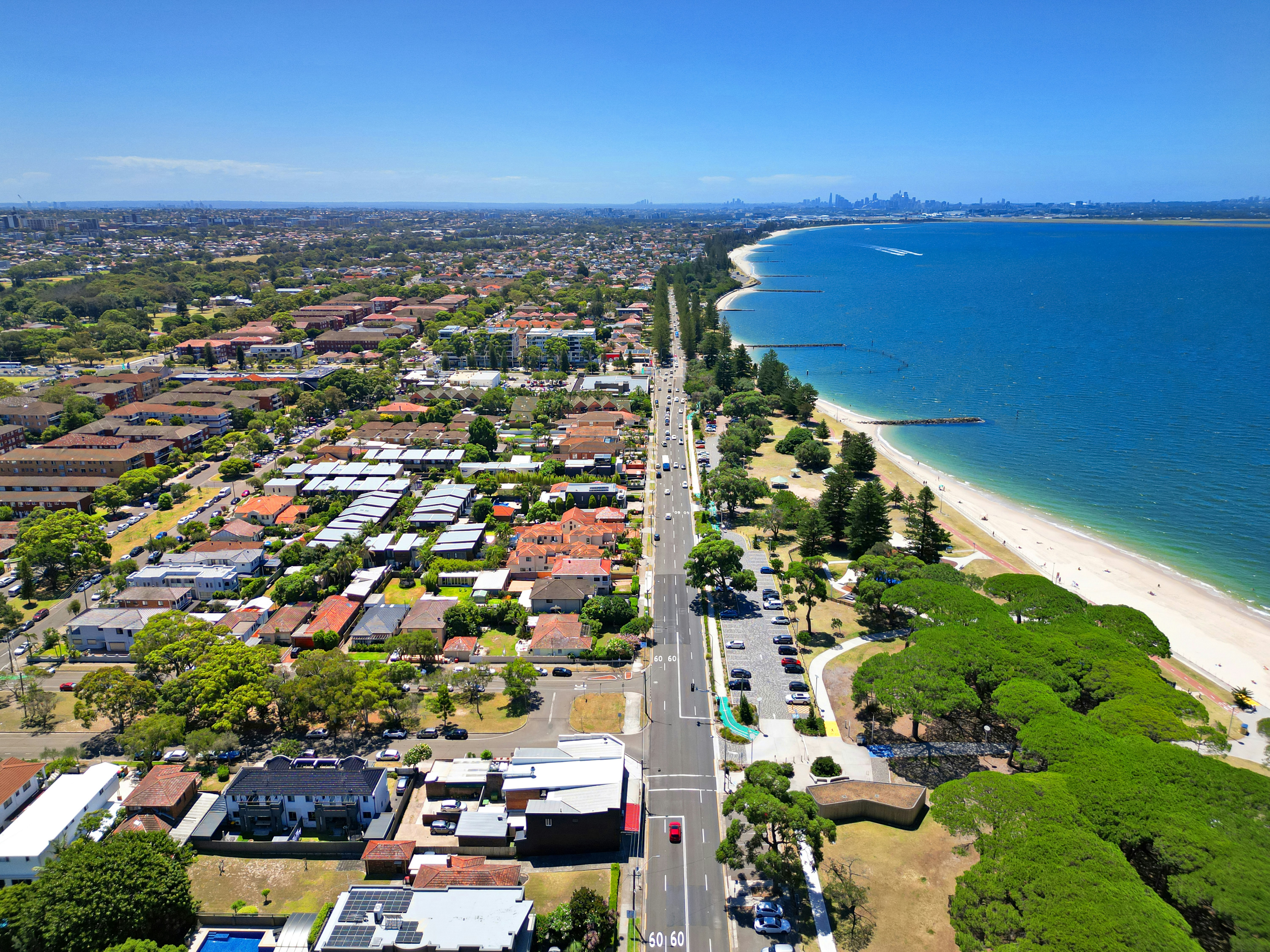 An aerial view of a beach town and the ocean photo – Free Car Image on ...