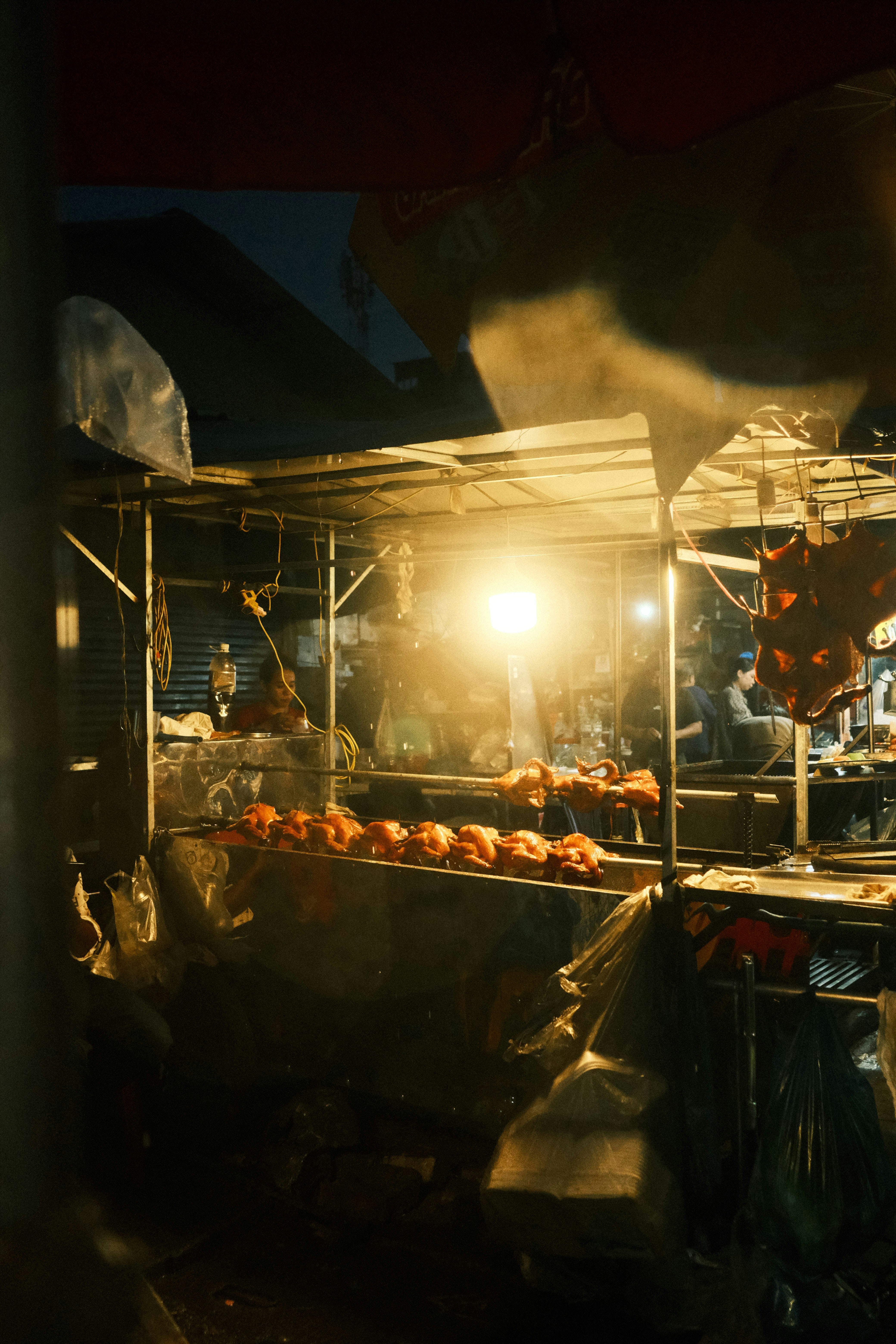 Lantern-lit Roast at a Night Market: Skewers Under Warm Glow