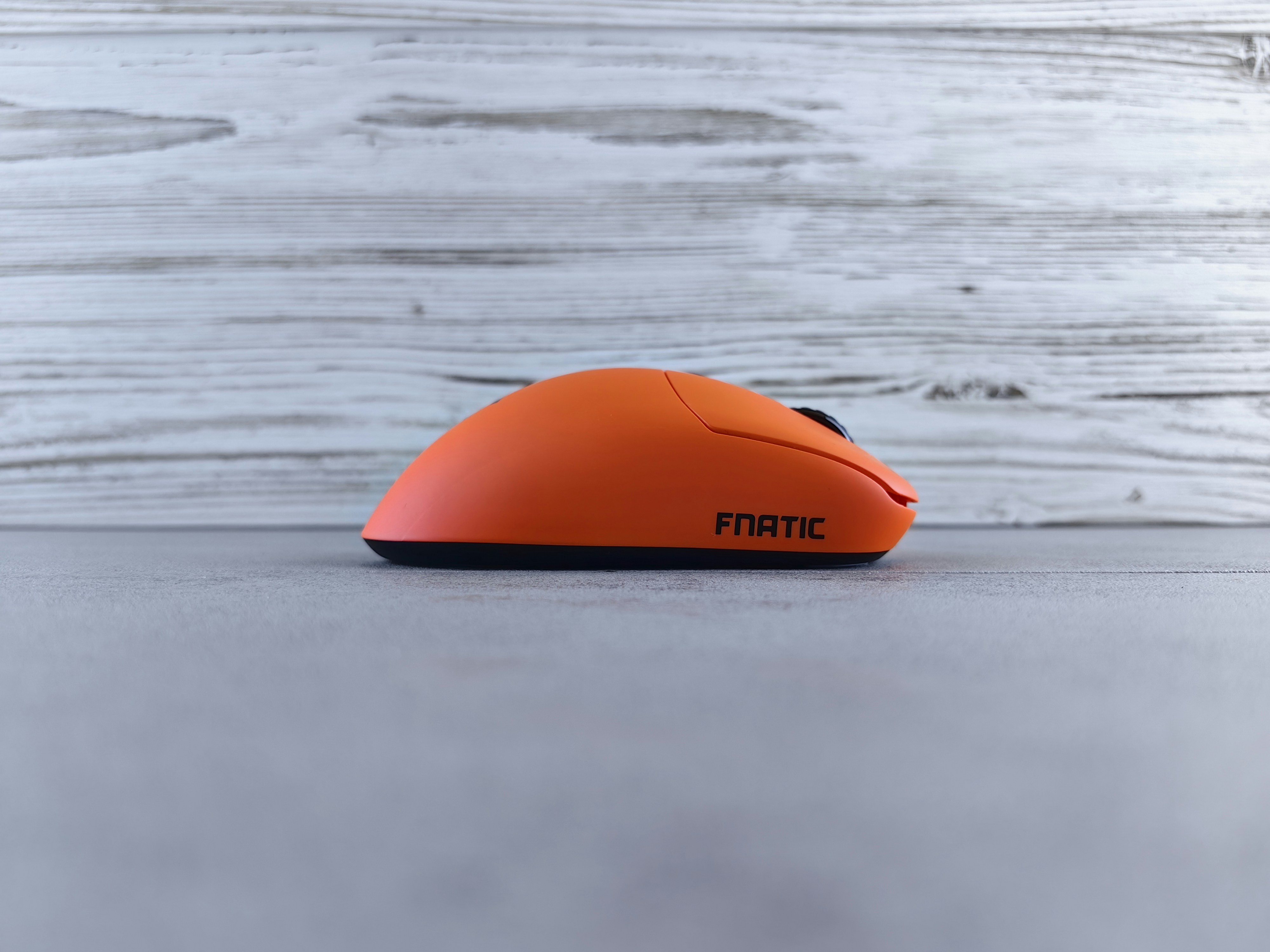 A computer mouse sitting on top of a table photo – Free Orange Image on ...