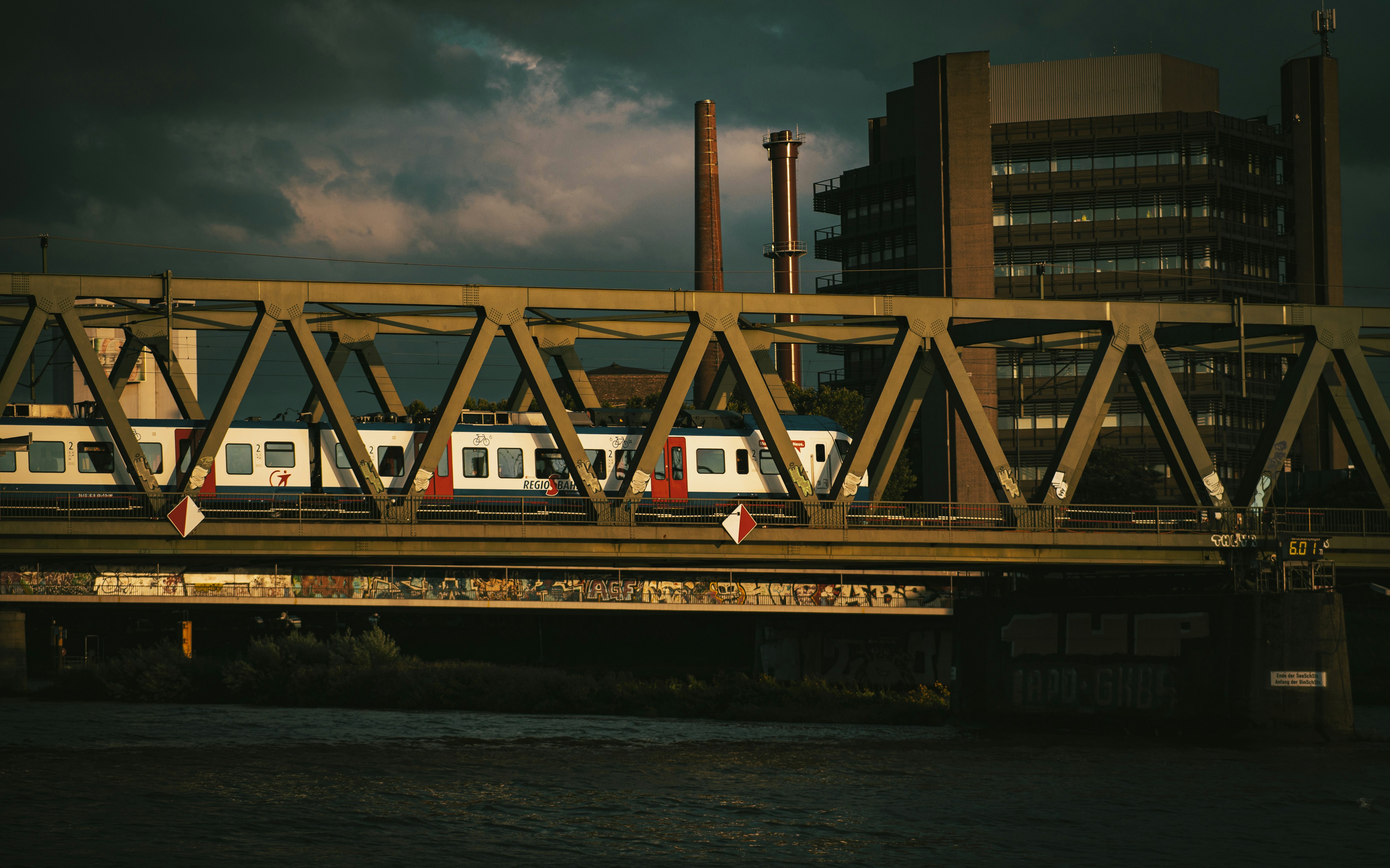 A train crossing a bridge over a body of water photo – Free Wallpaper ...
