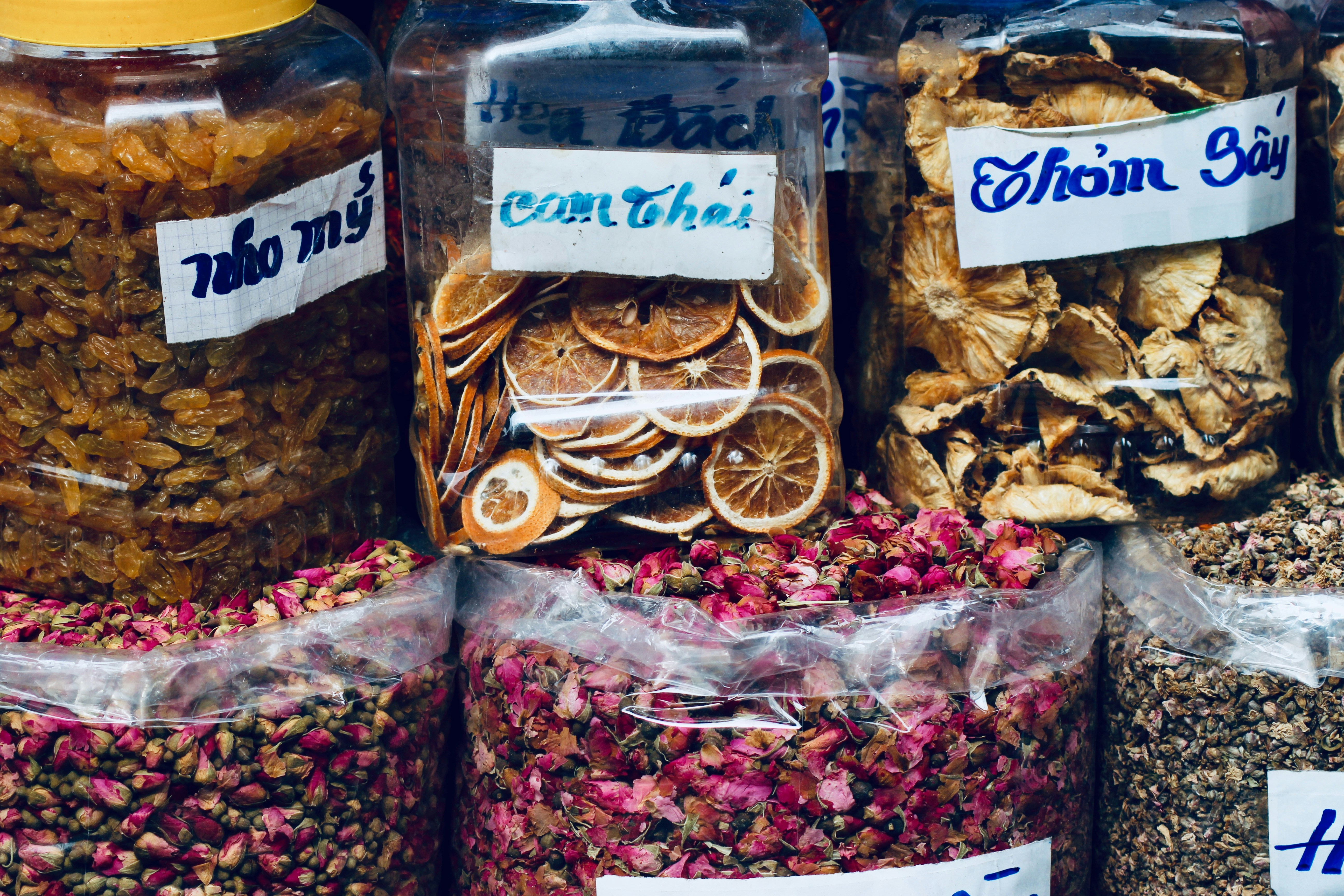 Bags of Aromatic Spices and Dried Fruits in a Market Stall