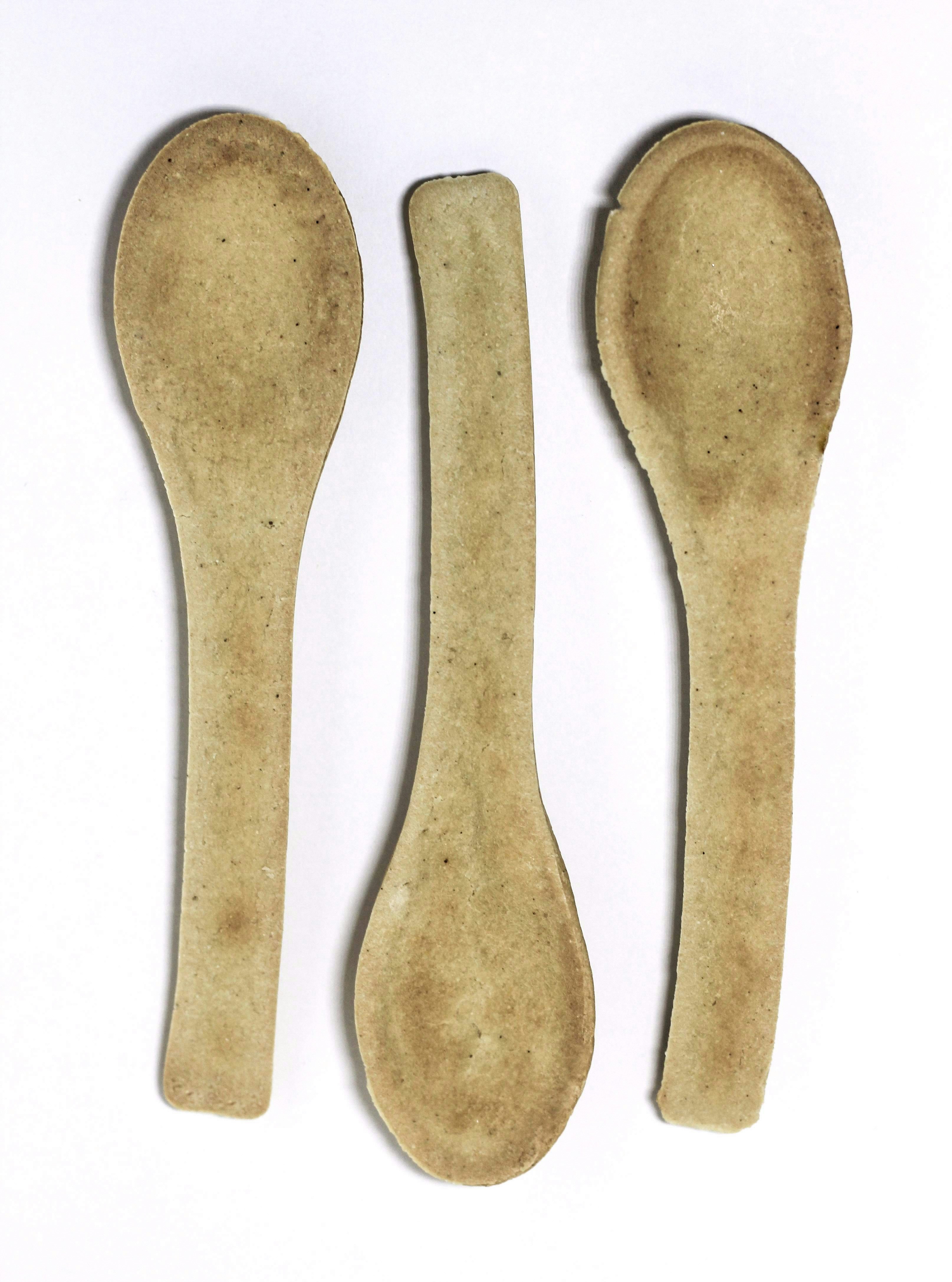 A couple of wooden spoons sitting next to each other photo – Free ...