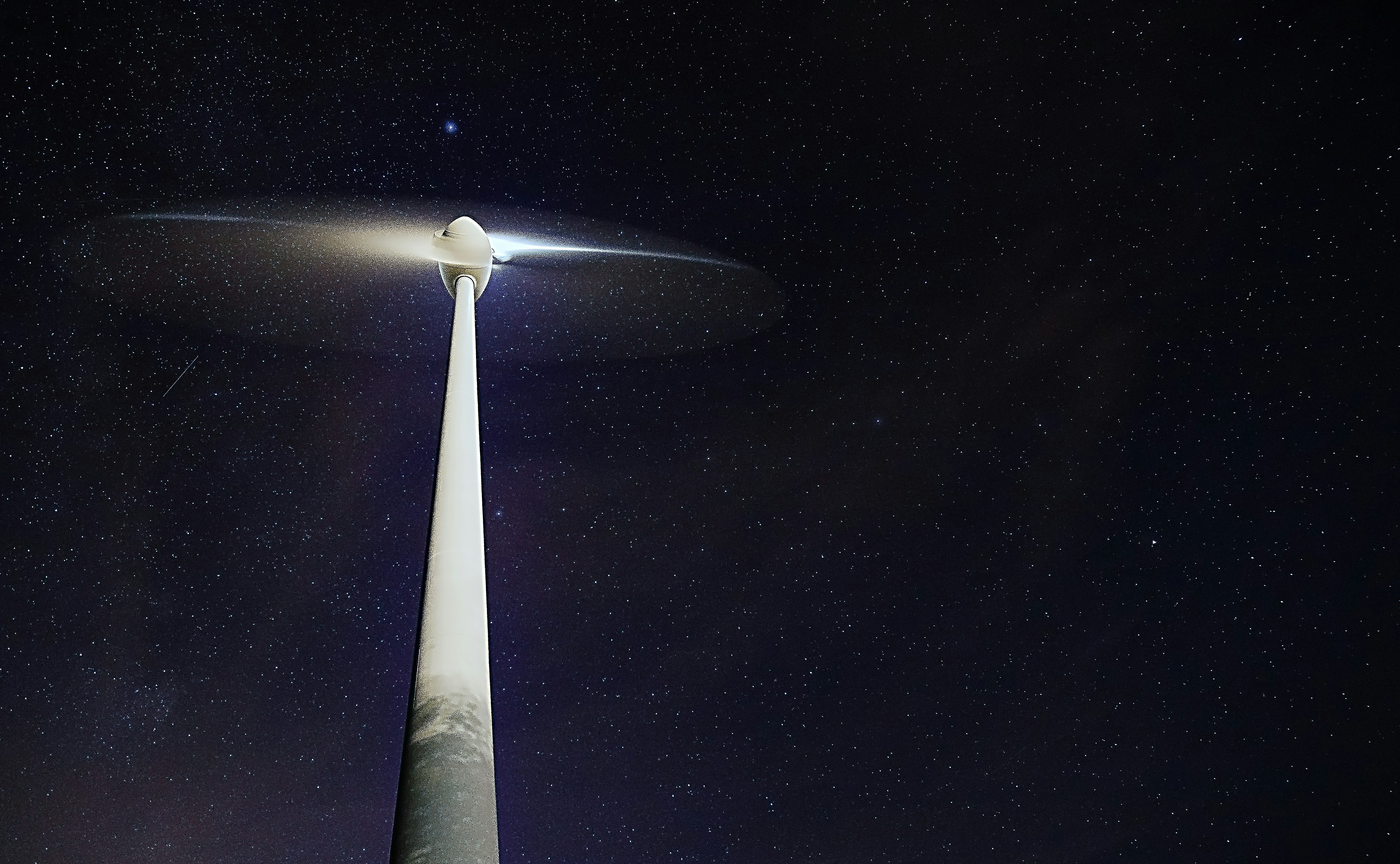 Rotor Night: A Wind Turbine Spear Piercing the Starry Silence