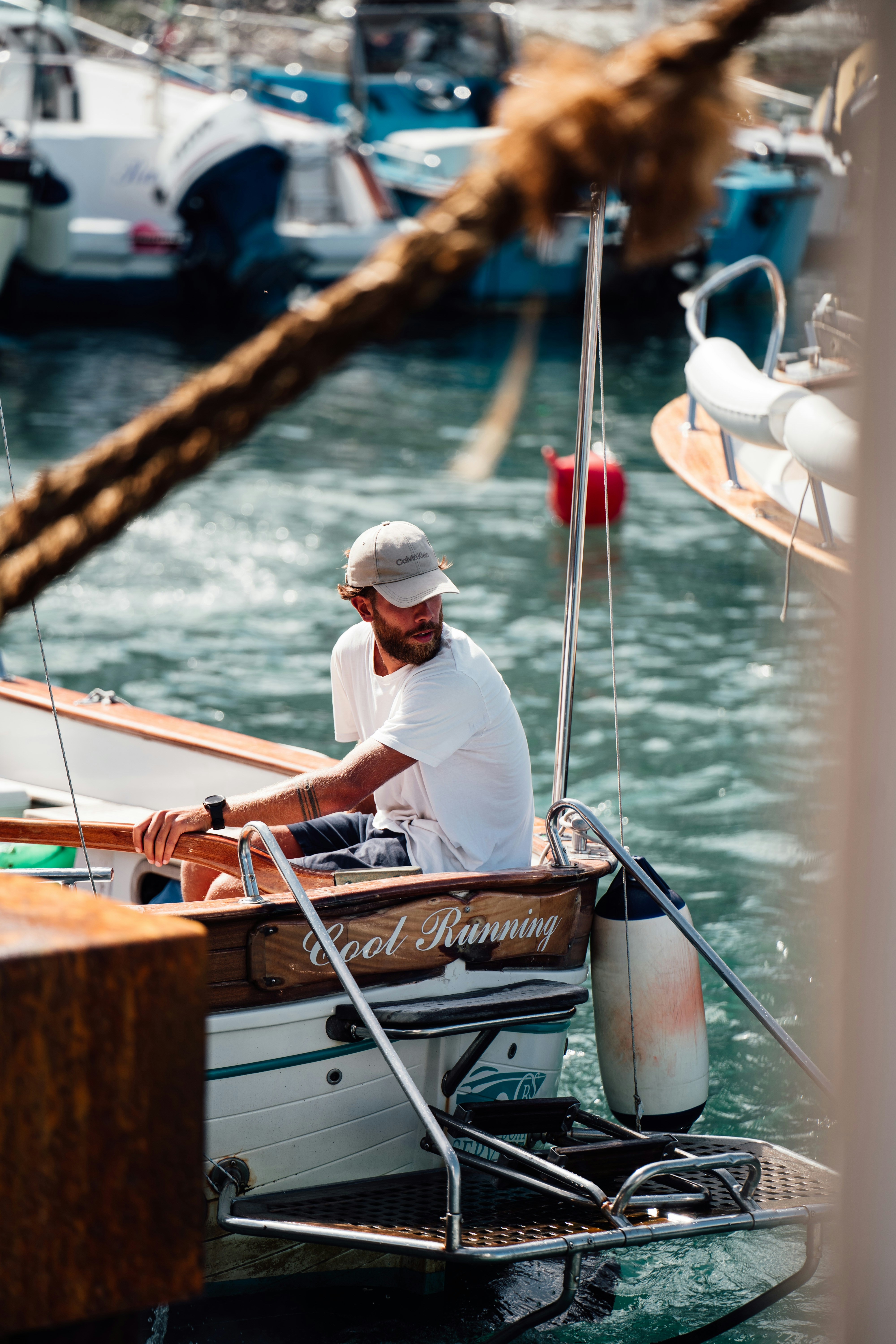 Harbor Row: A Quiet Moment Aboard a Weathered Wooden Boat