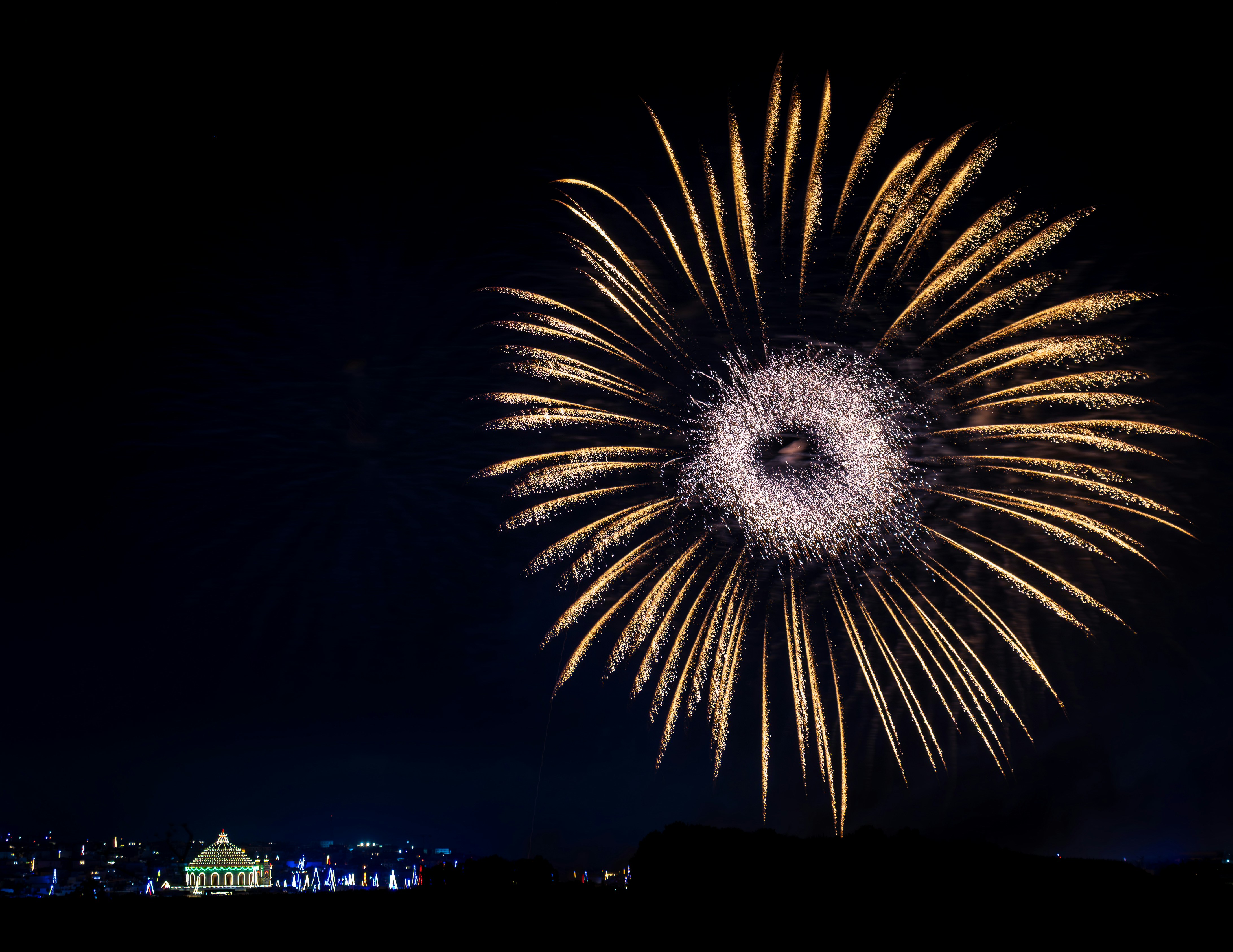 A large fireworks is lit up in the night sky photo – Free Mosta Image ...