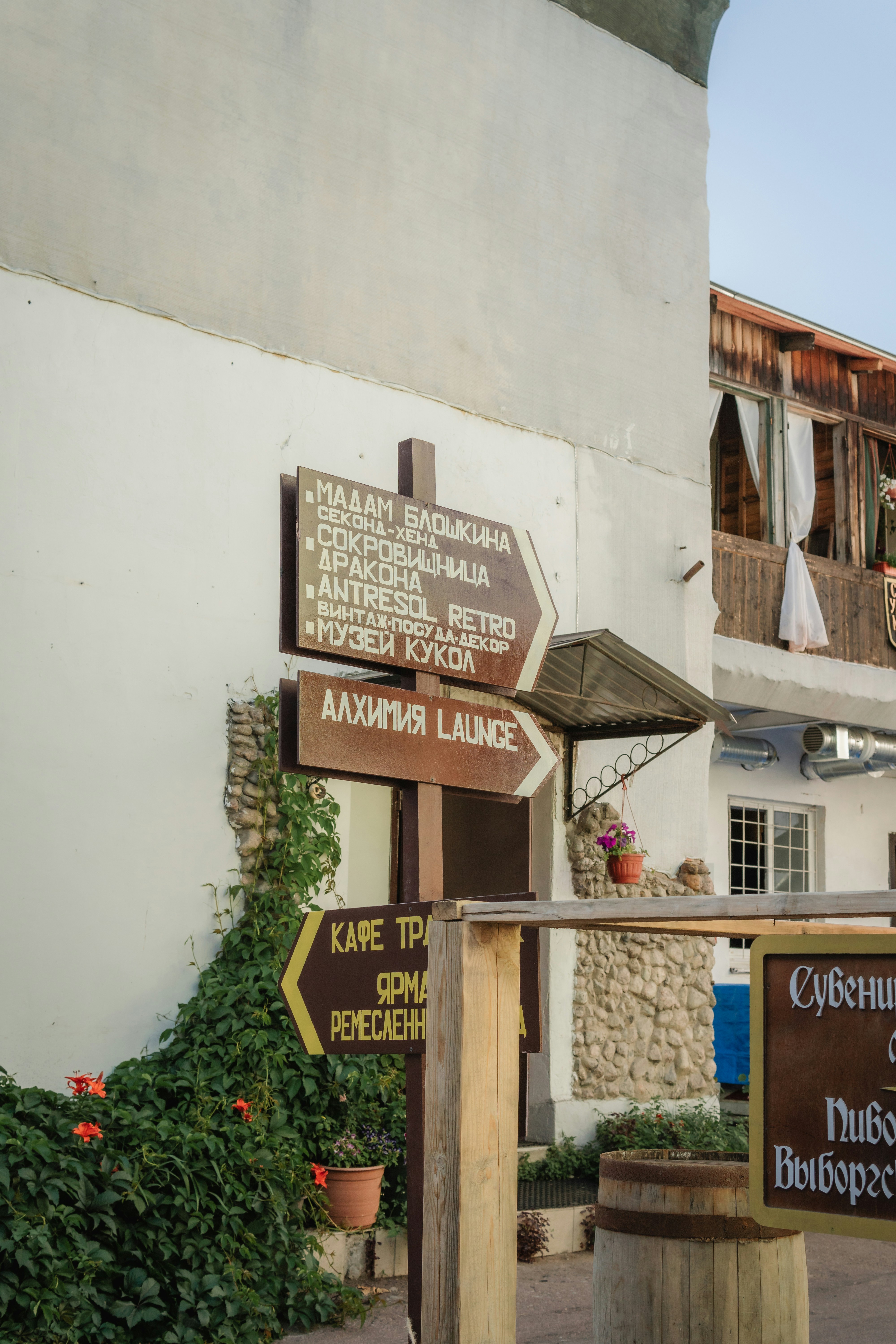 Weathered Signpost Junction in a Sunlit Village