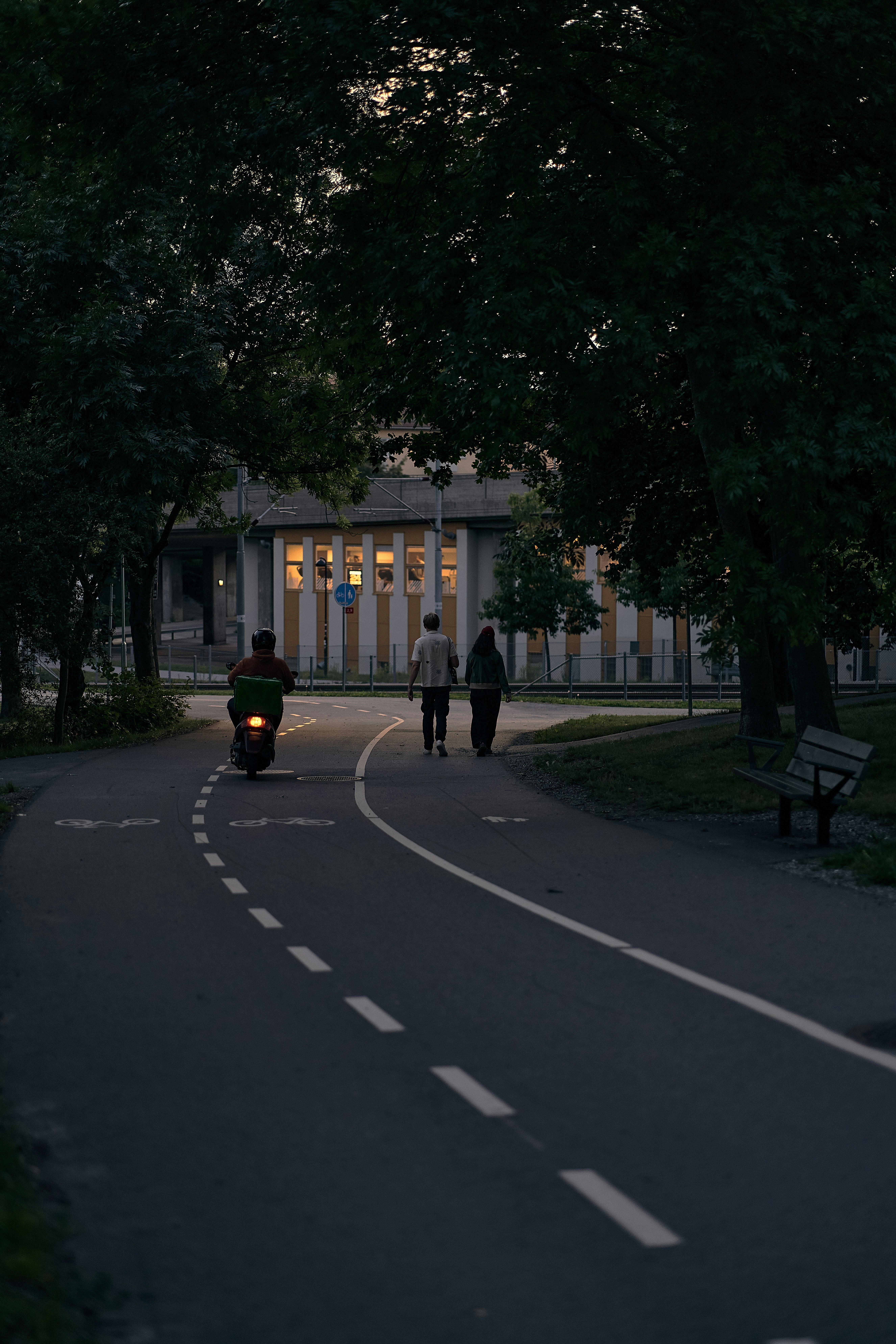 Two people walking down a street at night photo – Free Woman Image on Unsplash