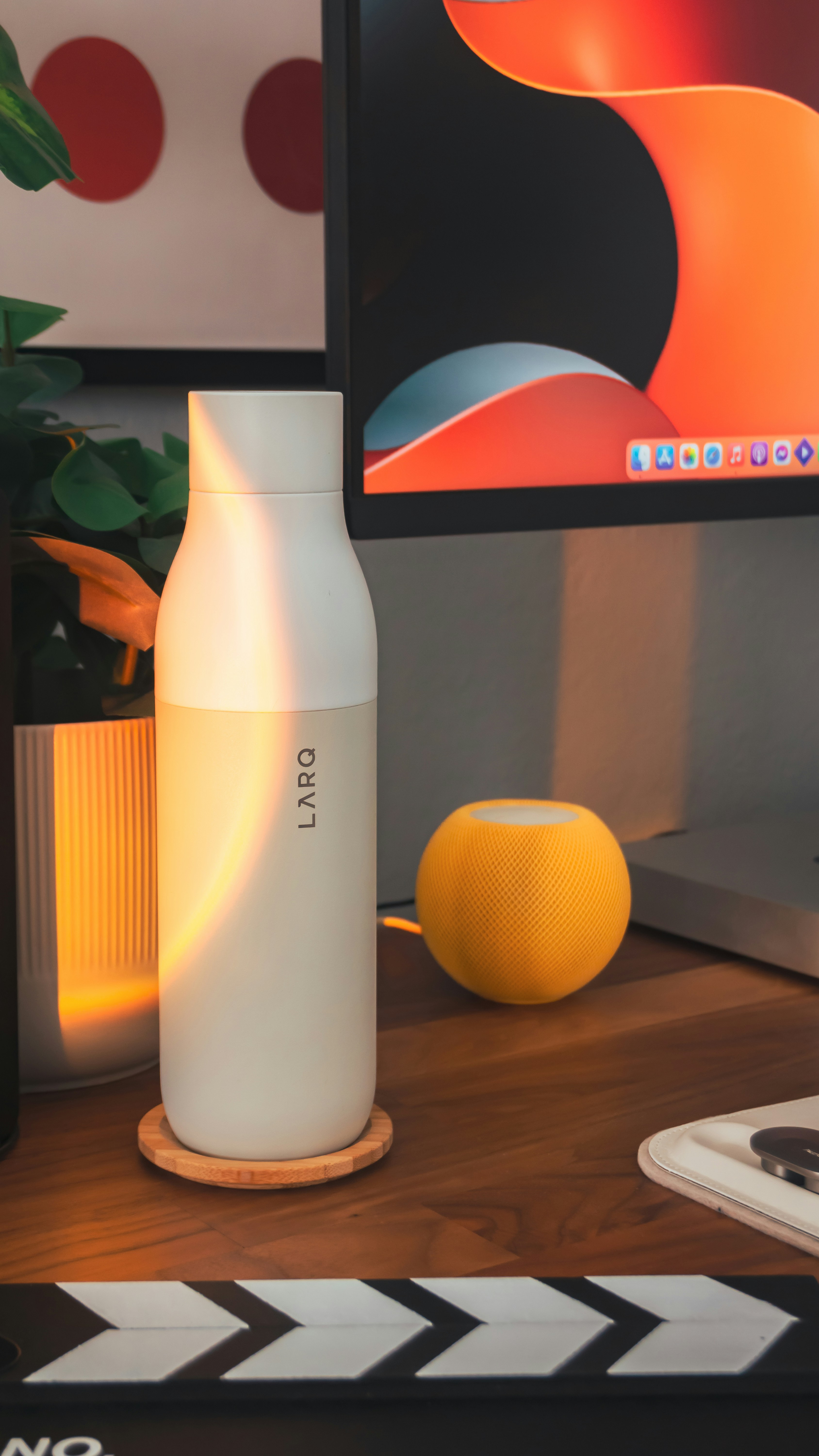 A computer desk with a monitor and a vase photo – Free Desk Image on ...