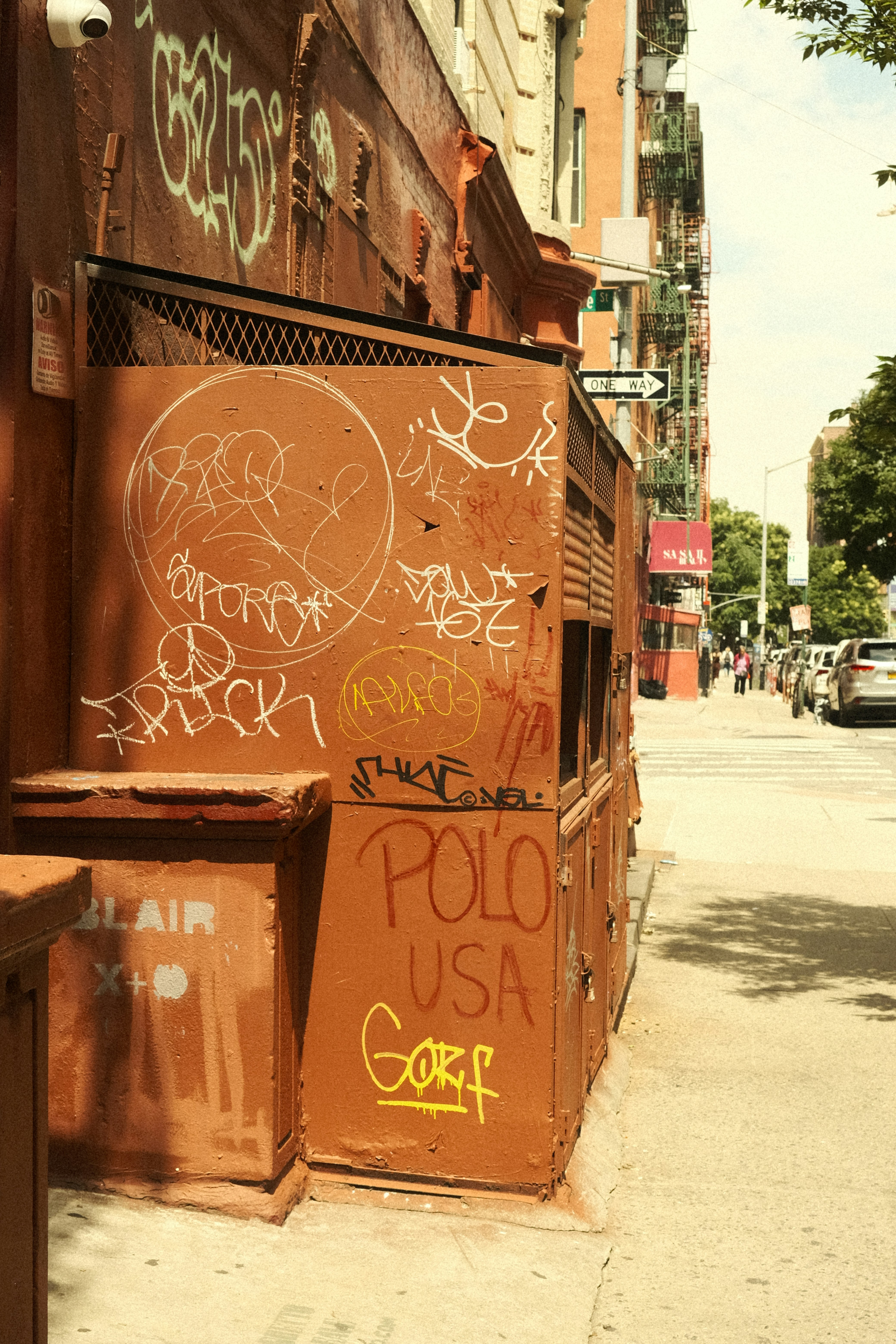 A street with a bunch of graffiti on the side of it photo – Free Street ...