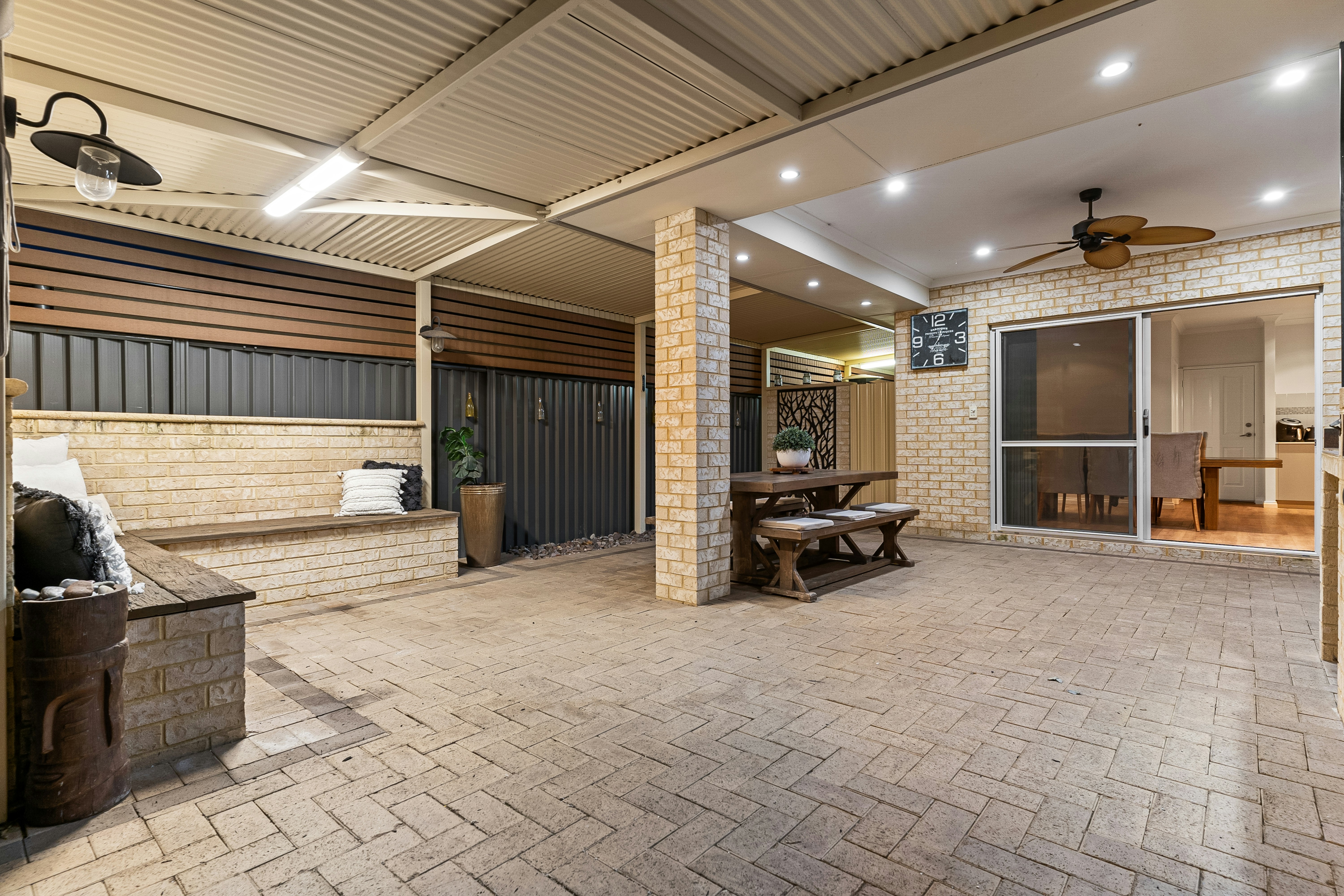 Brick Courtyard at Dusk: A Quiet Outdoor Dining Nook Under Soft Glow