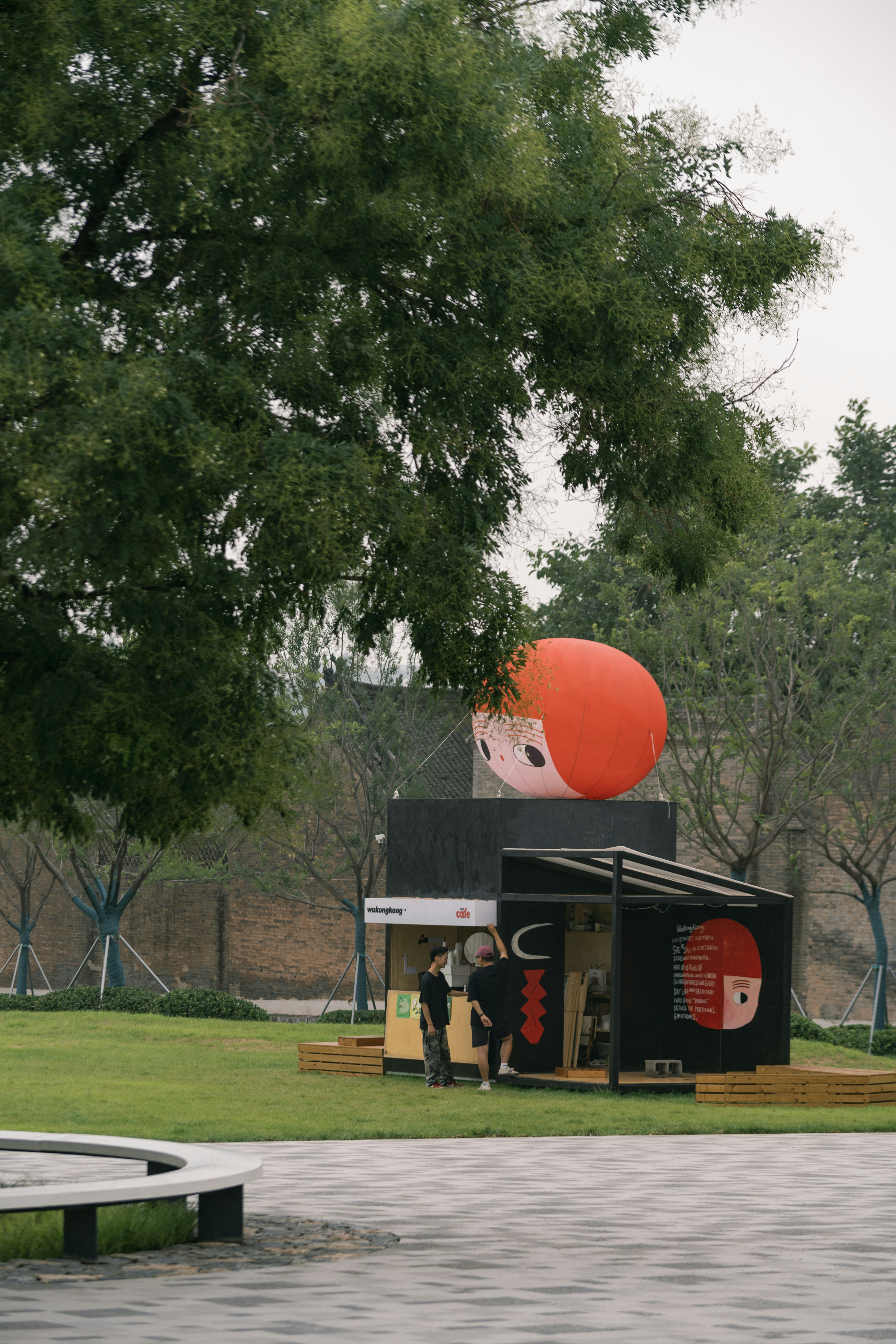 A large red ball sitting in the middle of a park photo – Free Outdoors ...