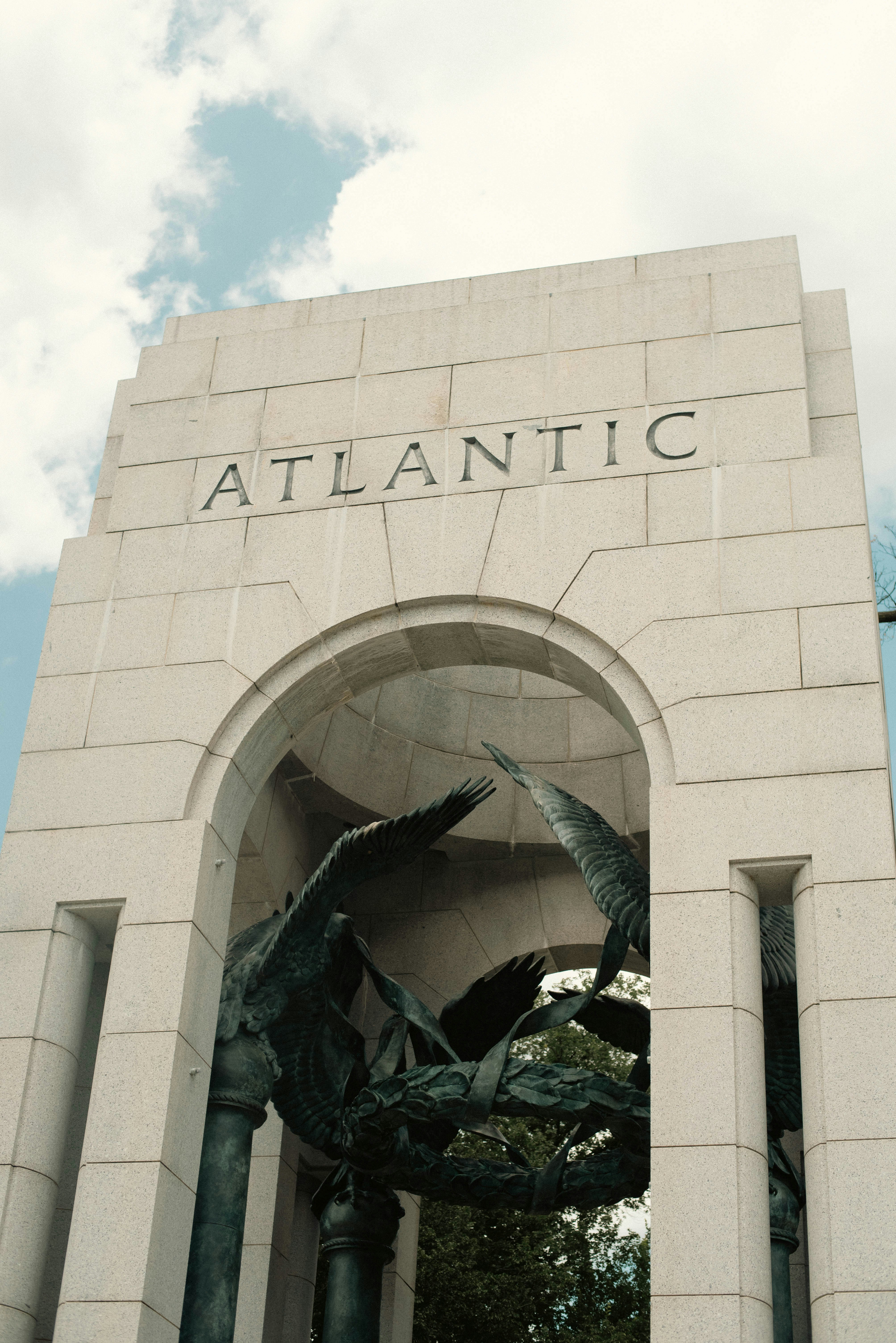 Atlantic Gate: Stone Arch Framing Bronze Seabird Sculptures