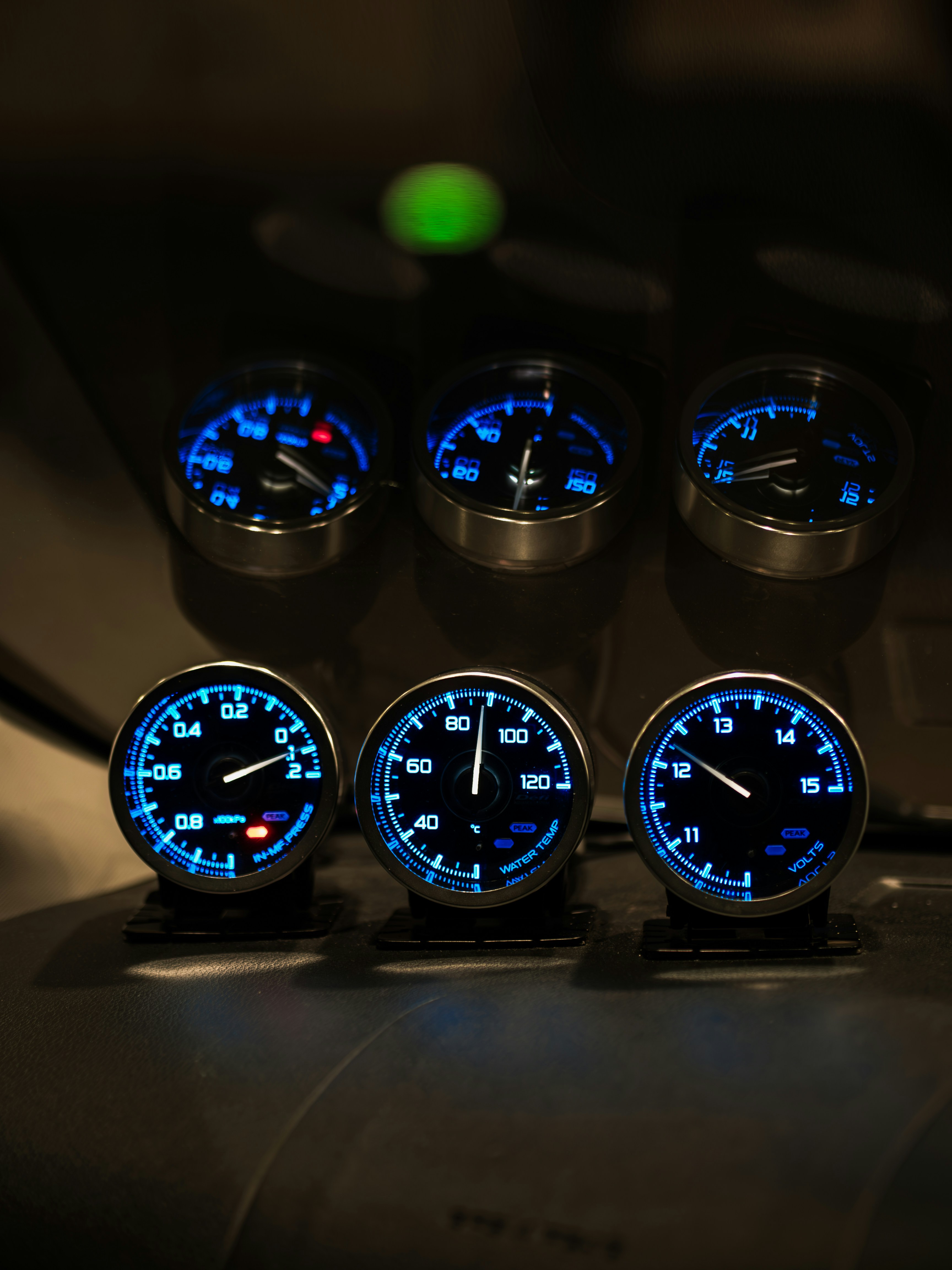 Blue Illuminated Gauges in a Dim Panel
