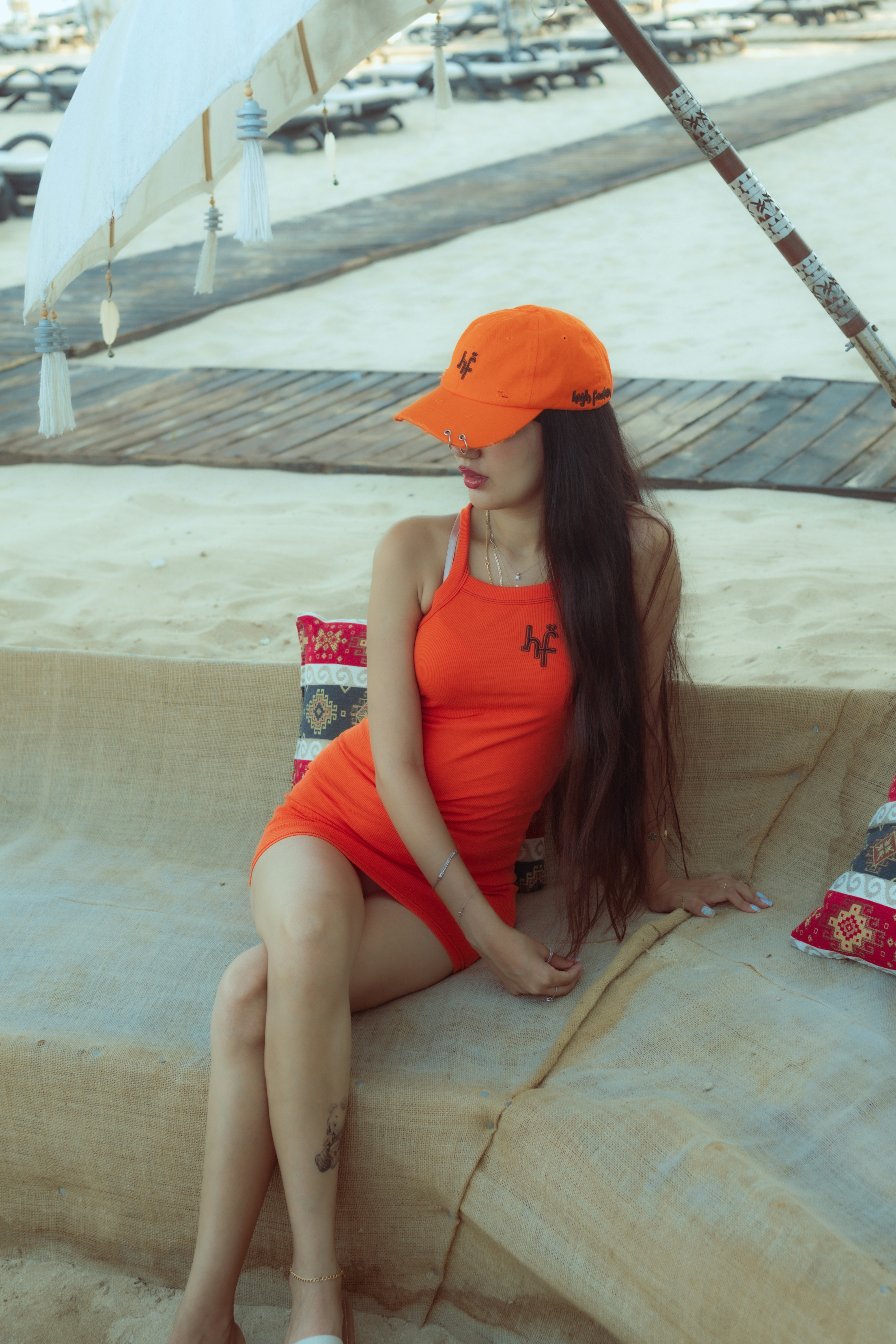 Crimson Dune Lounge: Orange on the Beach Under a Parasol