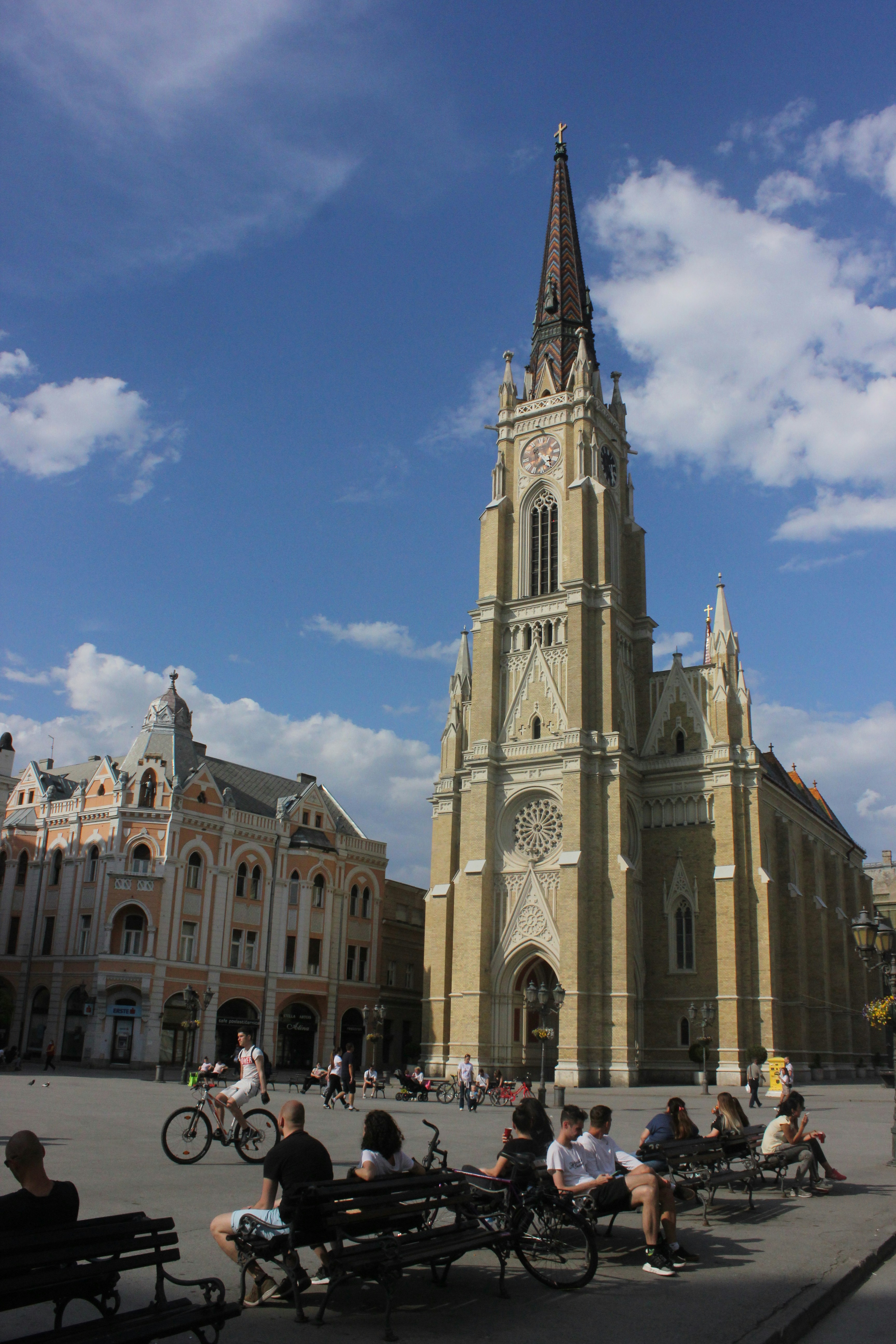 Gothic Spire Ascends Over a Busy City Square