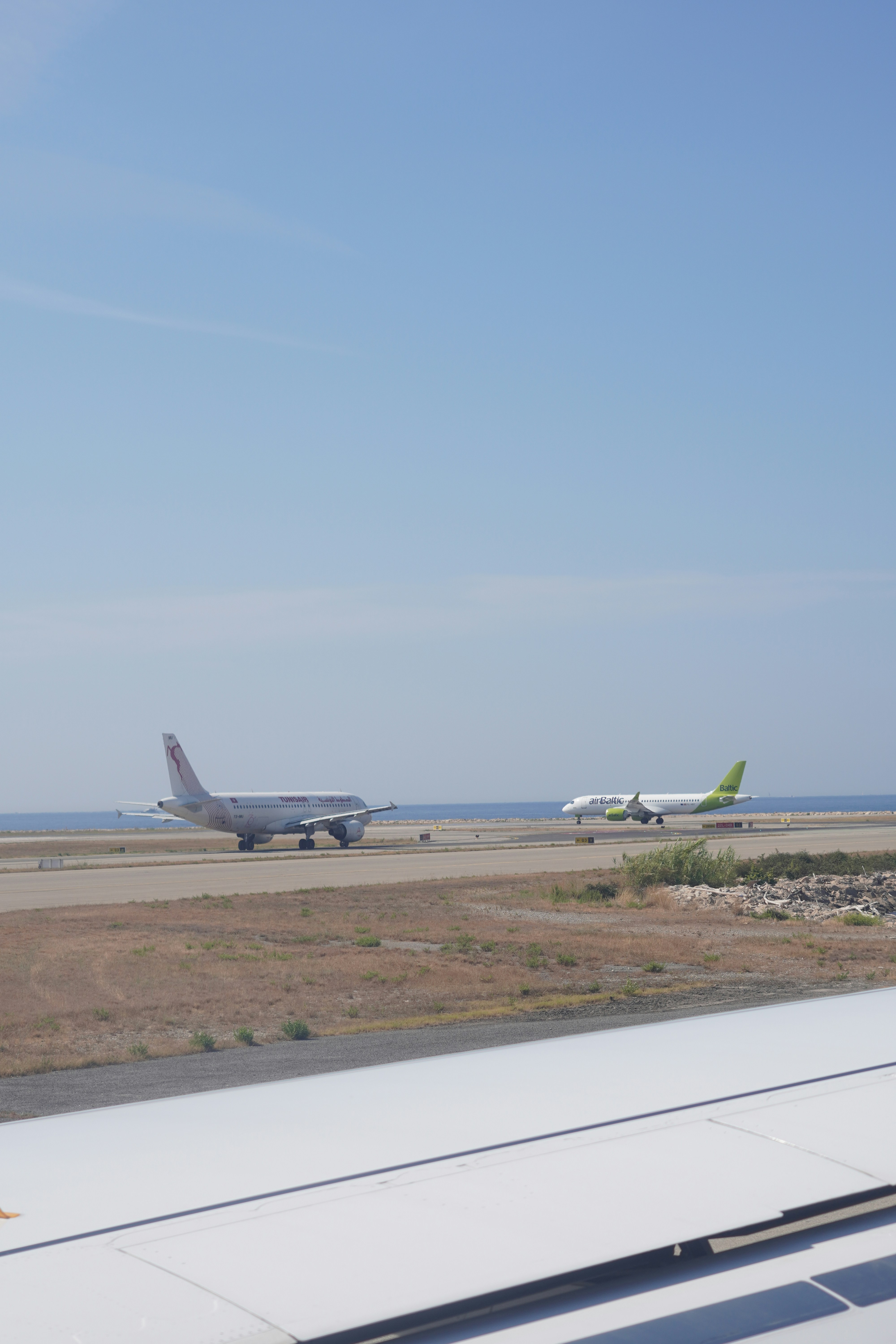 Quiet Tarmac Standoff: A Pair of Aircraft at Dawn