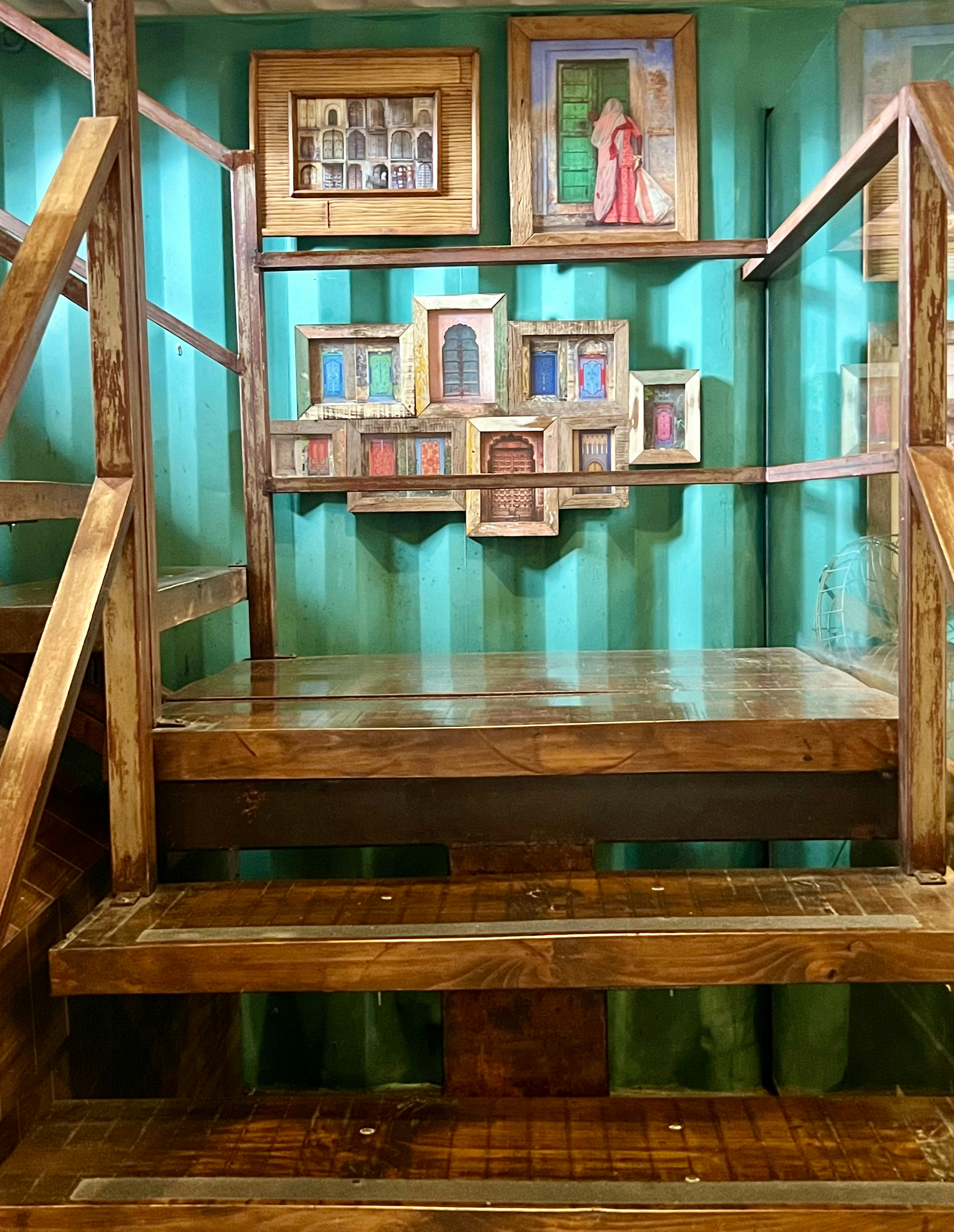 Staircase Gallery on Teal: Tiny Frames Framed in Wood