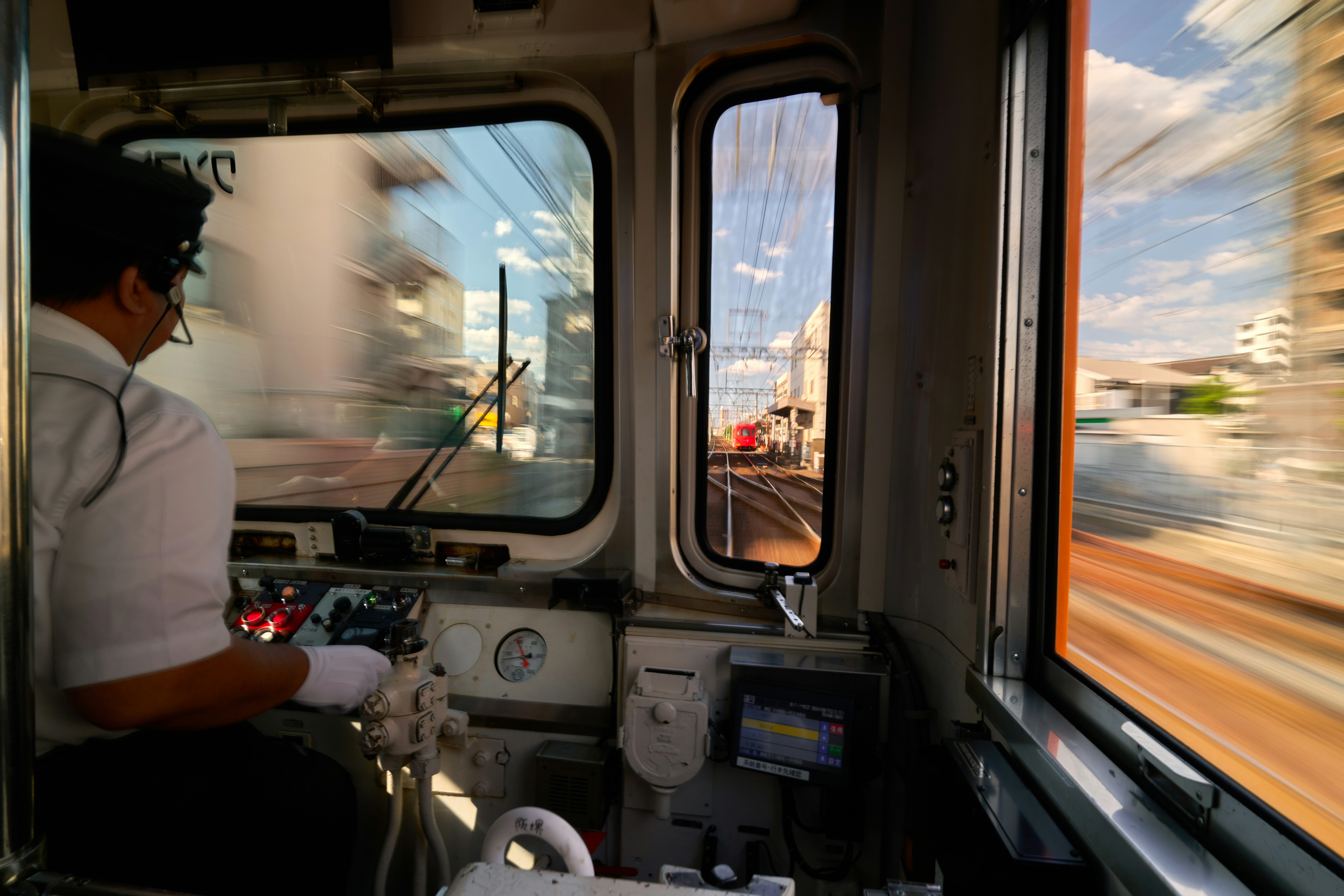 A man driving a train through a train station photo – Free Woman Image ...