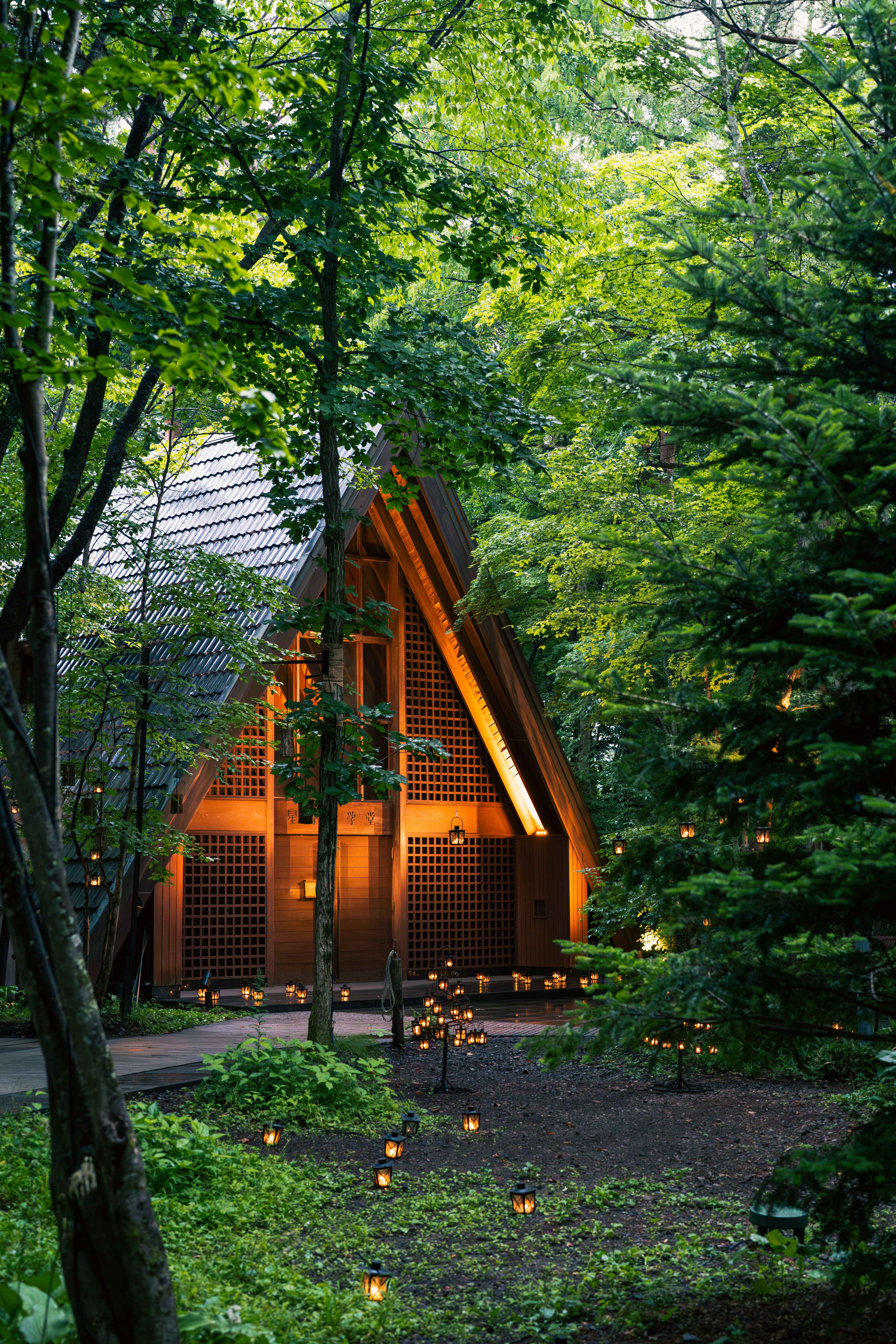 Amber Glow Over a Forest A-Frame Lodge