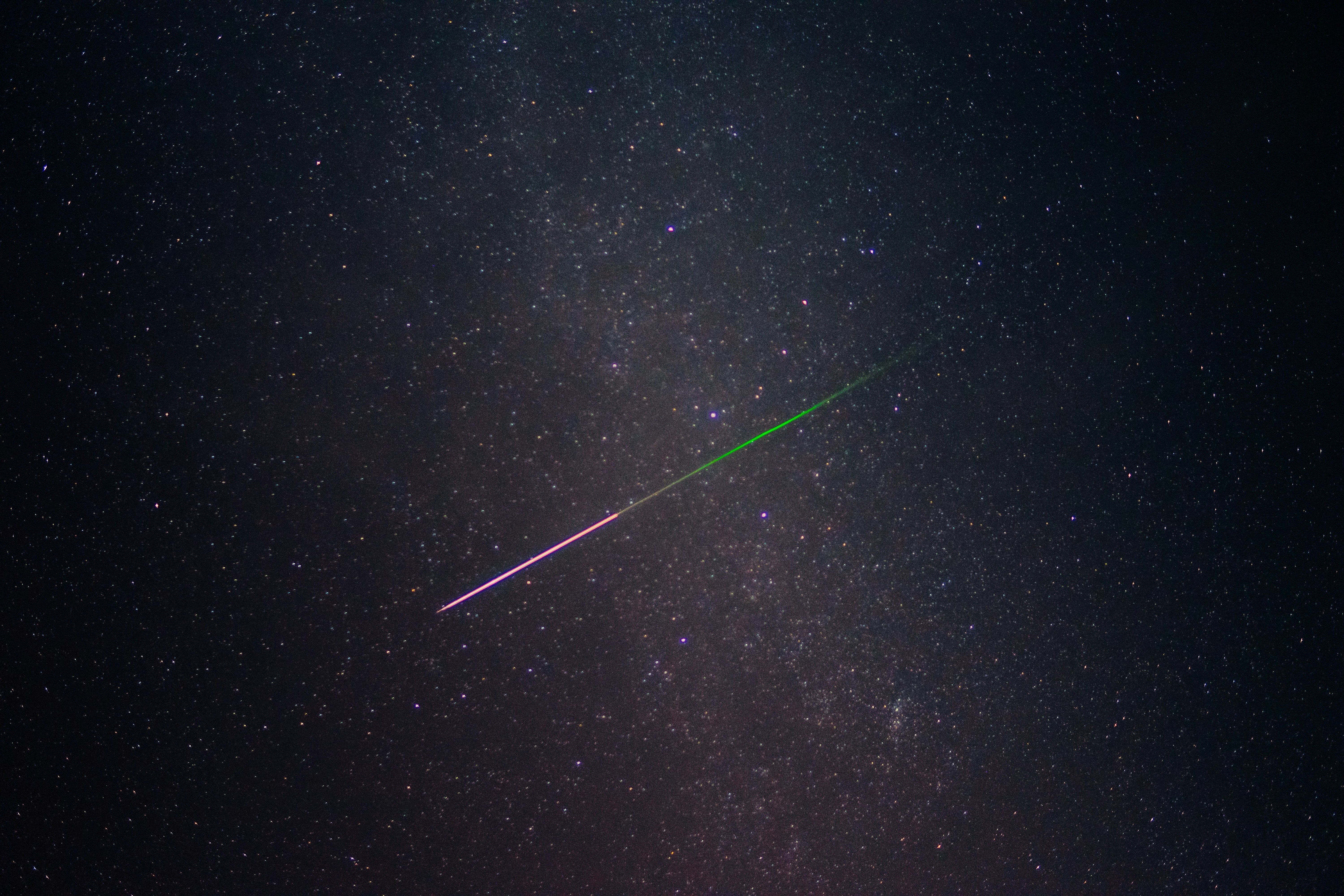 A plane flying through the night sky with stars photo – Free Asheville ...