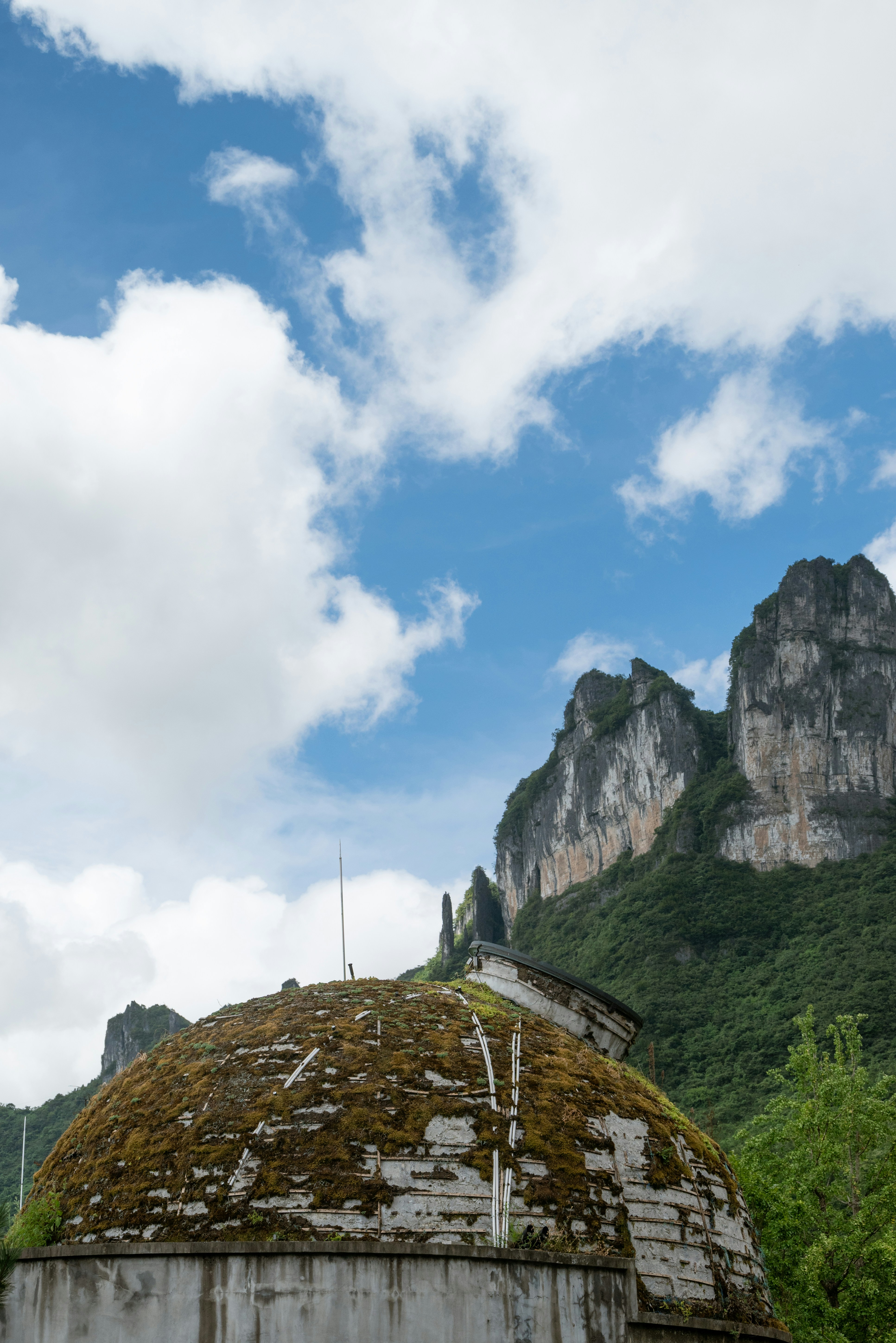 Moss-Clad Rotunda Framed by Rugged Peaks