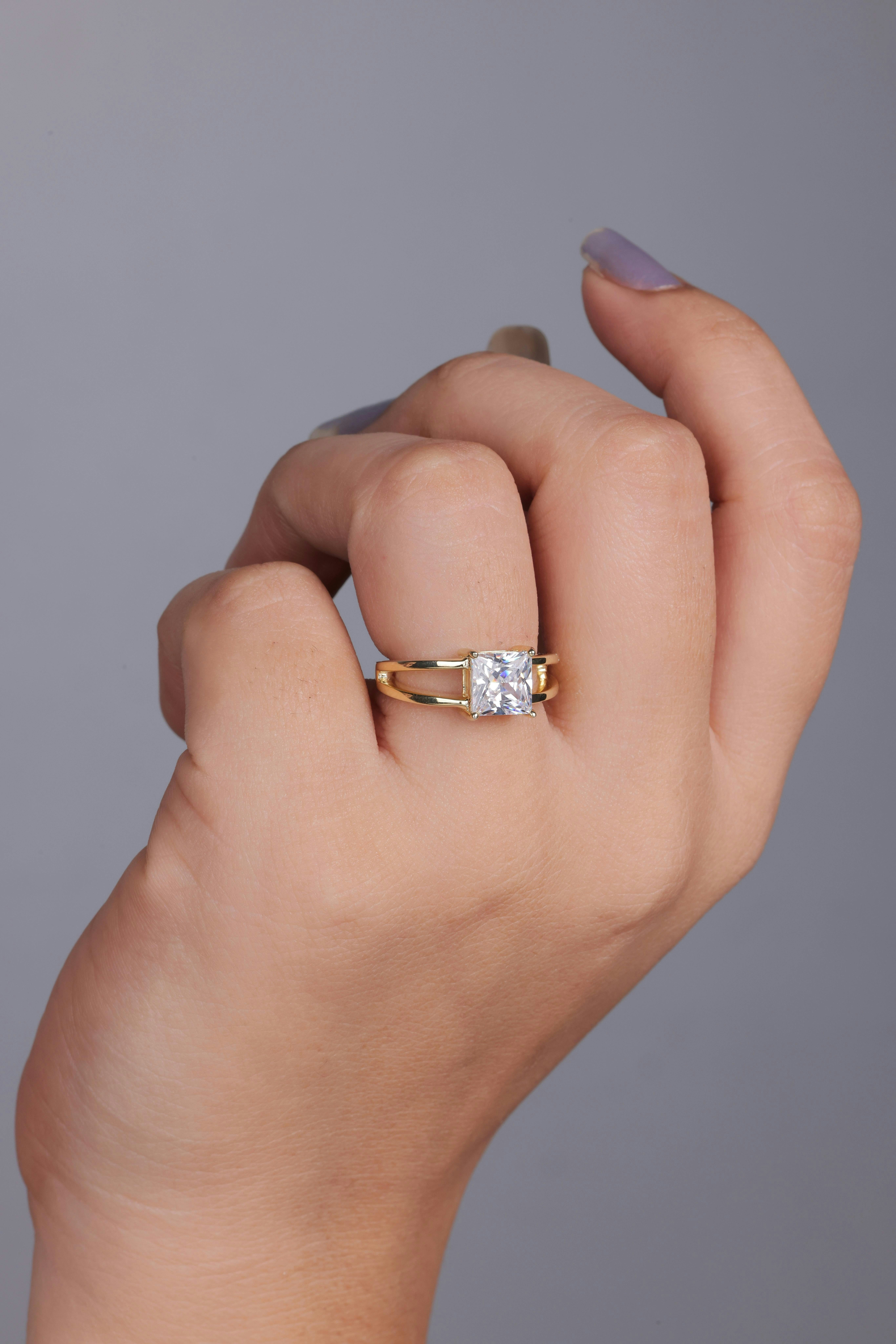 A woman's hand holding a diamond ring photo – Free Wedding Image on ...