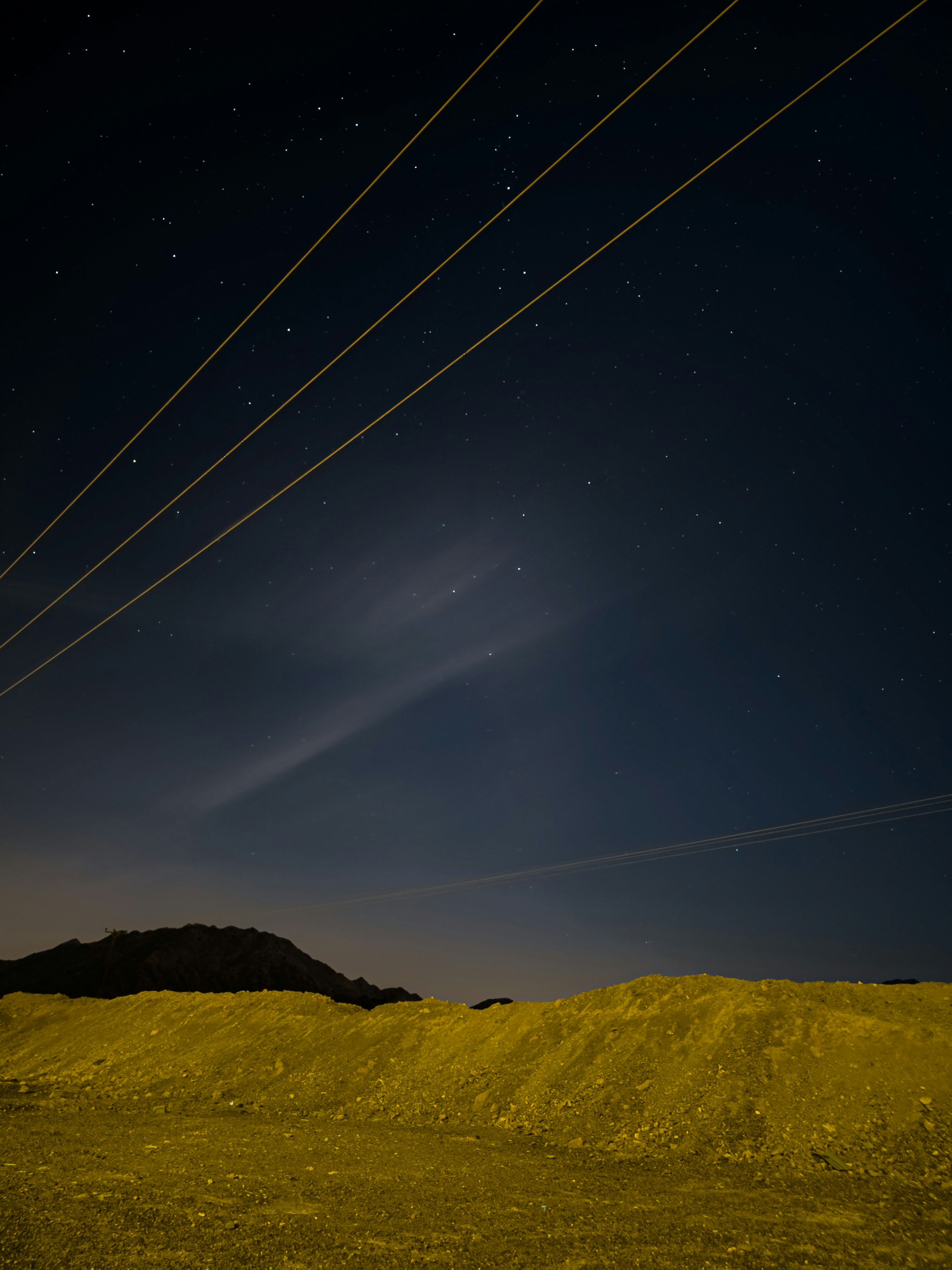 Starlit Ridge: Night Sky Over a Quiet Desert Hill