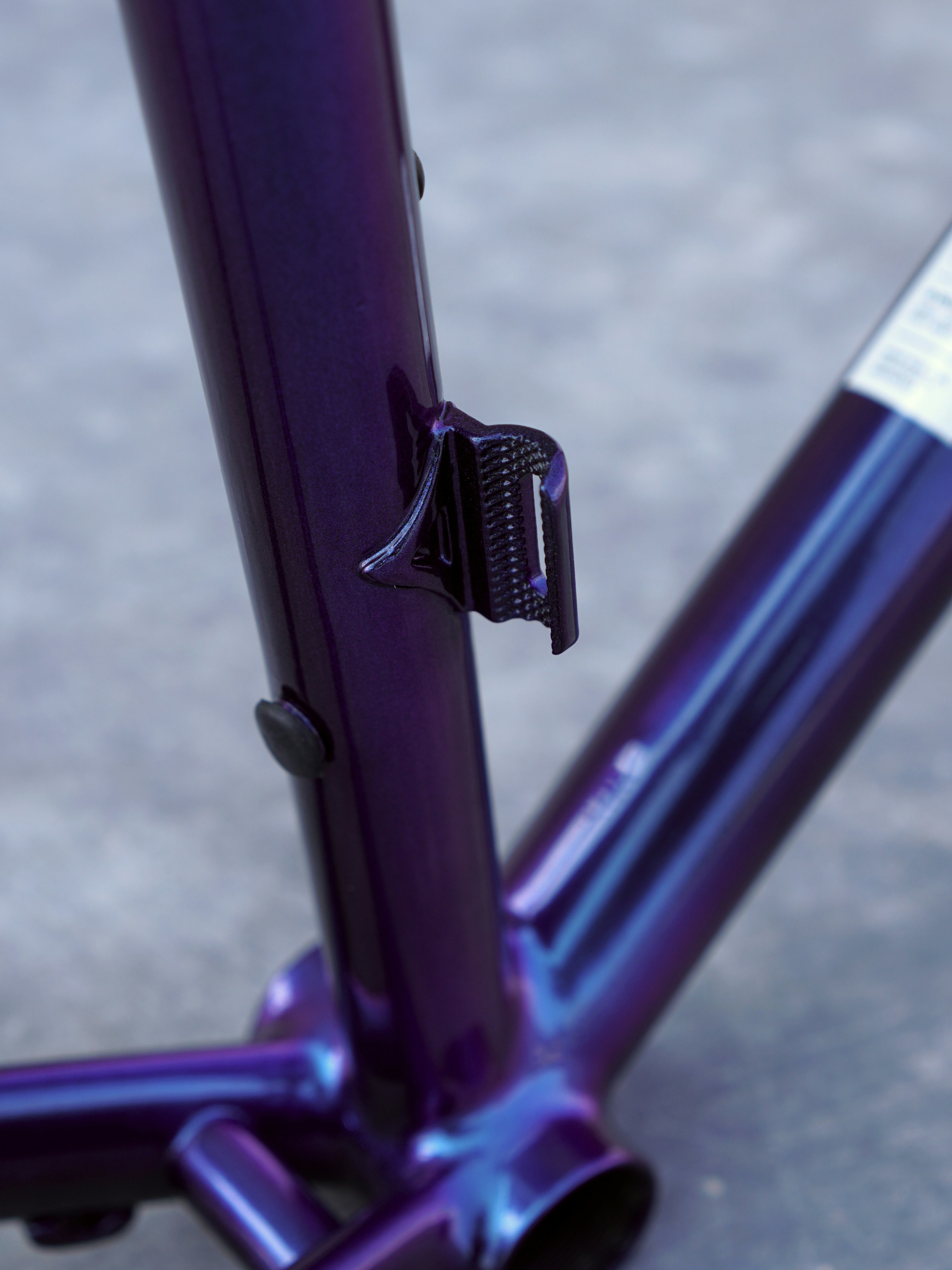 A close up of a purple bike frame photo – Free Gun Image on Unsplash